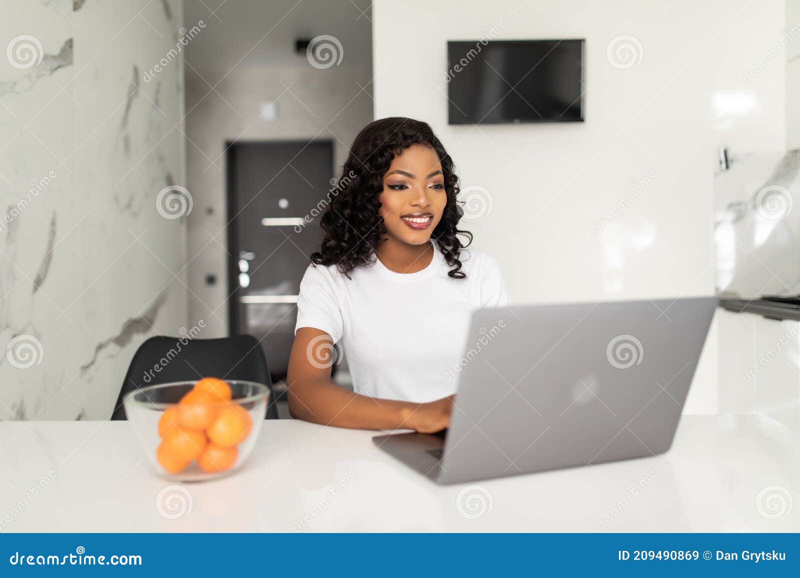 Smiling African Woman Using Computer in Modern Kitchen Interior Stock ...