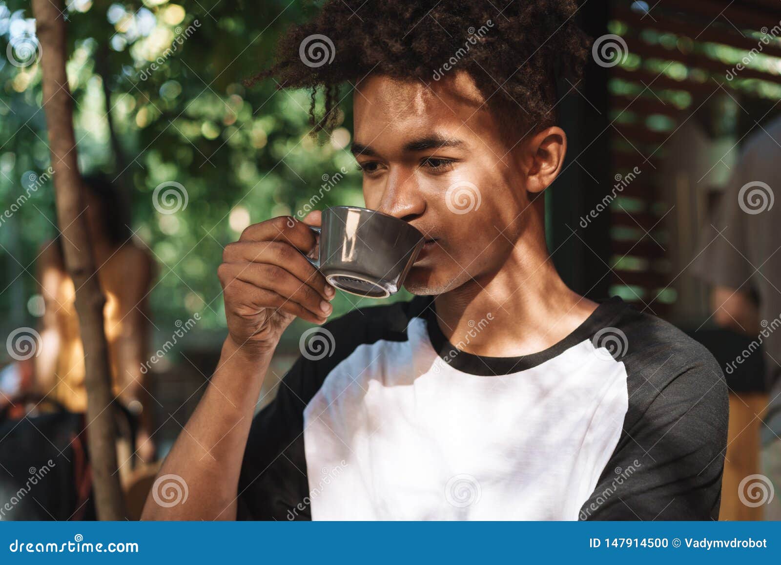 Smiling African Young Man Drinking Coffee at the Cafe Stock Photo ...