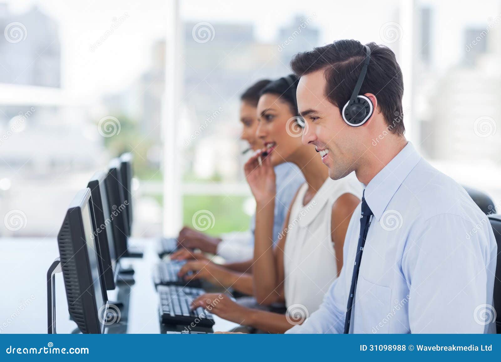 Smiling Agent Working in a Call Centre Stock Photo - Image of ...