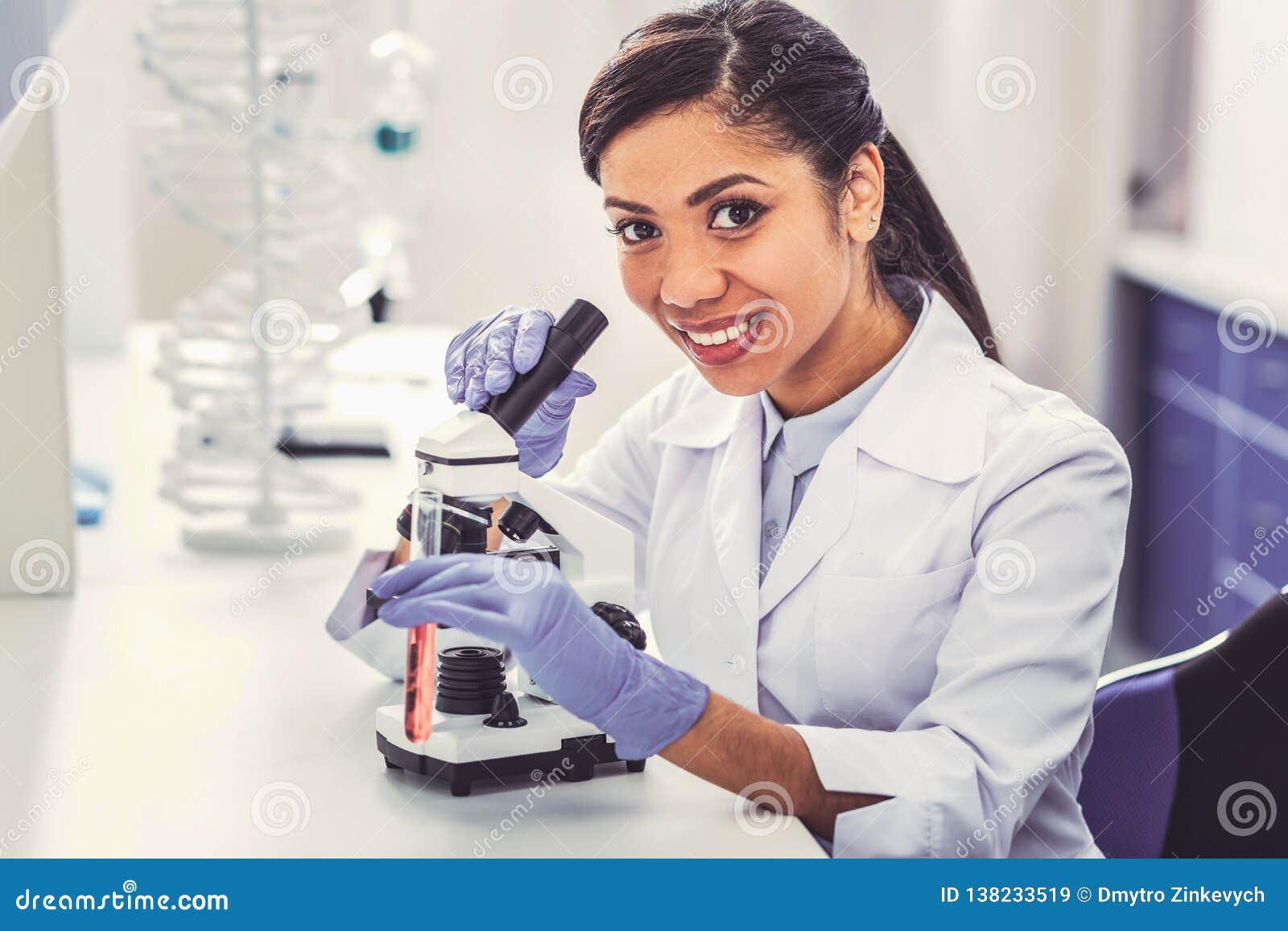 Smiling Appealing Chemist Looking into Microscope Stock Image - Image ...