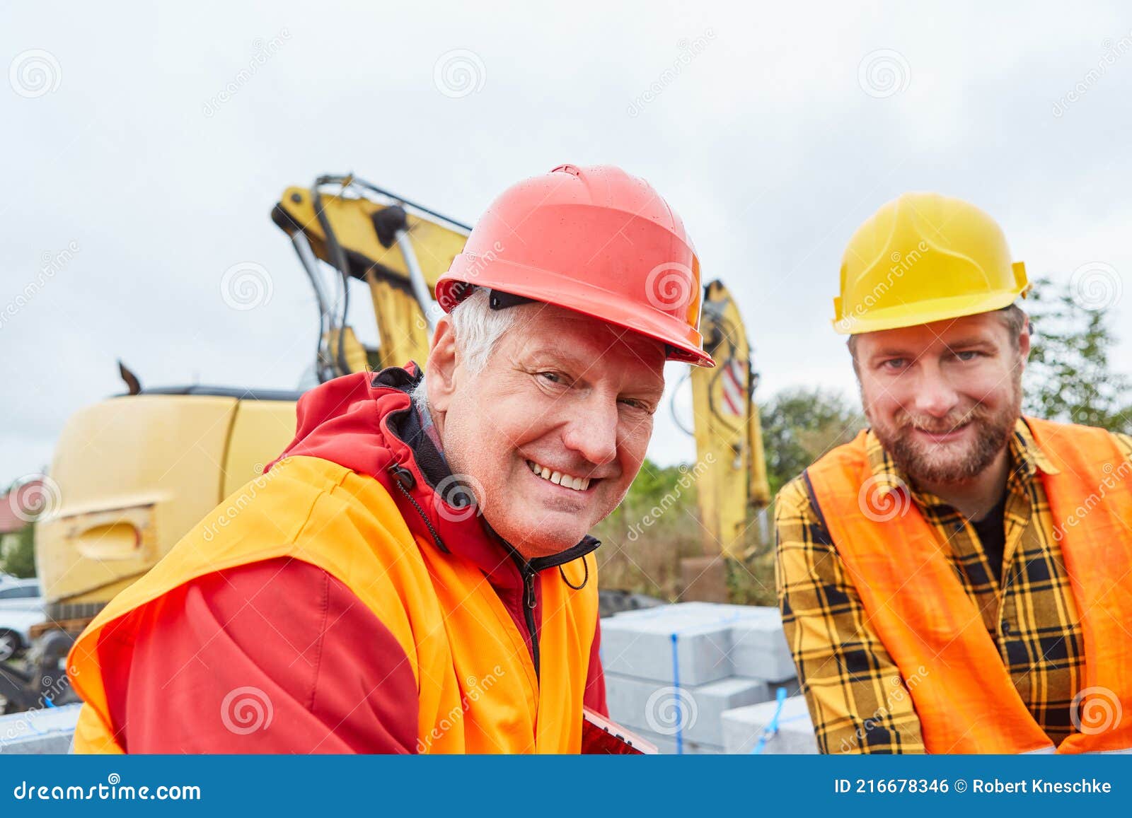 Smiling Architect and Construction Worker on Construction Site Stock ...