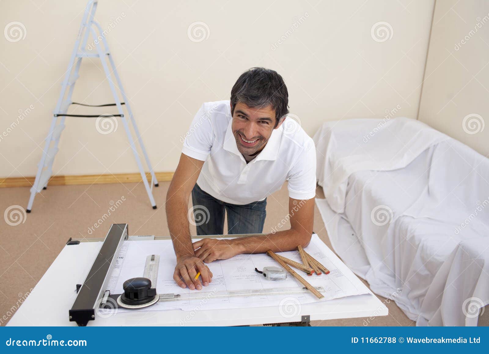 Smiling Architect Man Decorating a Bedroom Stock Photo - Image of ...