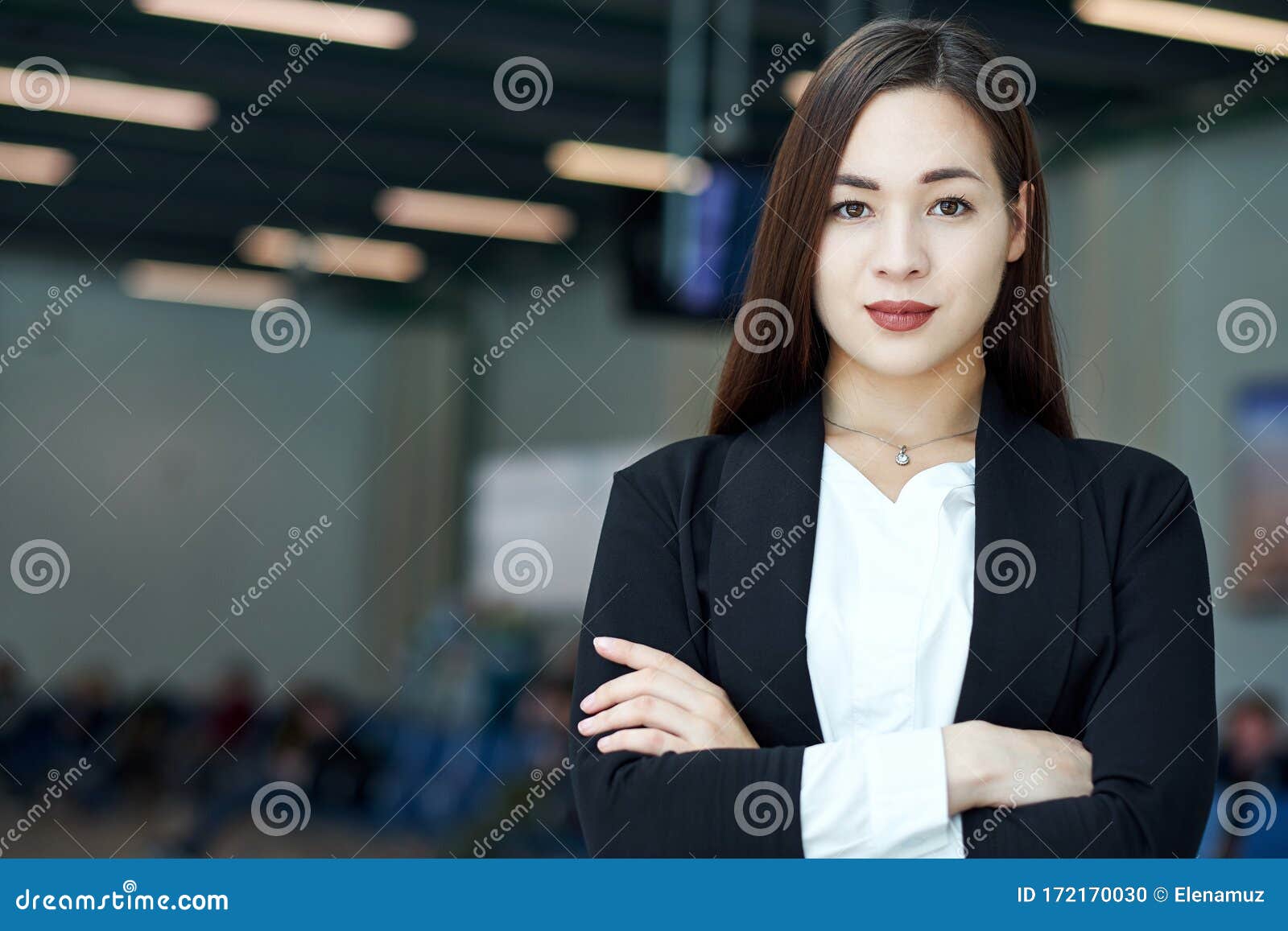 Smiling Asian Business Woman in Modern Office or Meeting Room. Crossed ... Smiling Asian Business Woman in Modern Office or Meeting Room. Crossed ...