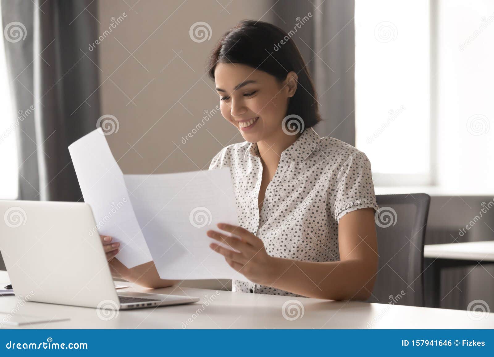 Smiling Asian Business Woman Satisfied with New Project First Results ... Smiling Asian Business Woman Satisfied with New Project First Results ...