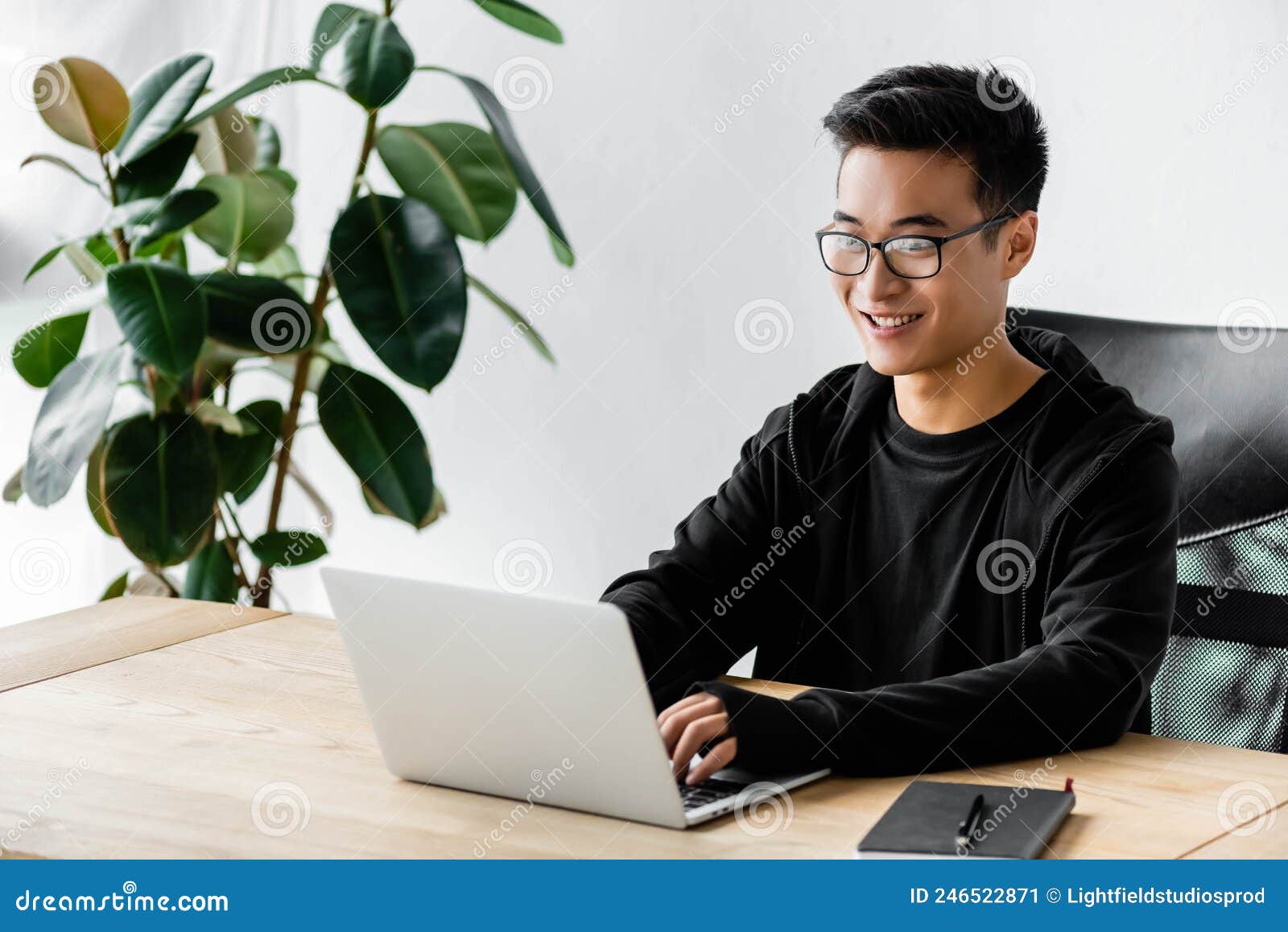 Smiling Asian Hacker in Glasses Sitting Stock Image - Image of inside ...