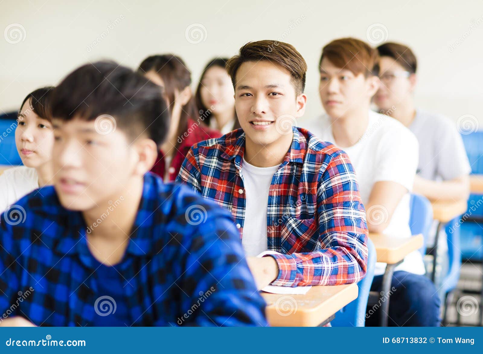 Smiling Asian Male College Student Sitting with Classmates Stock Photo ...