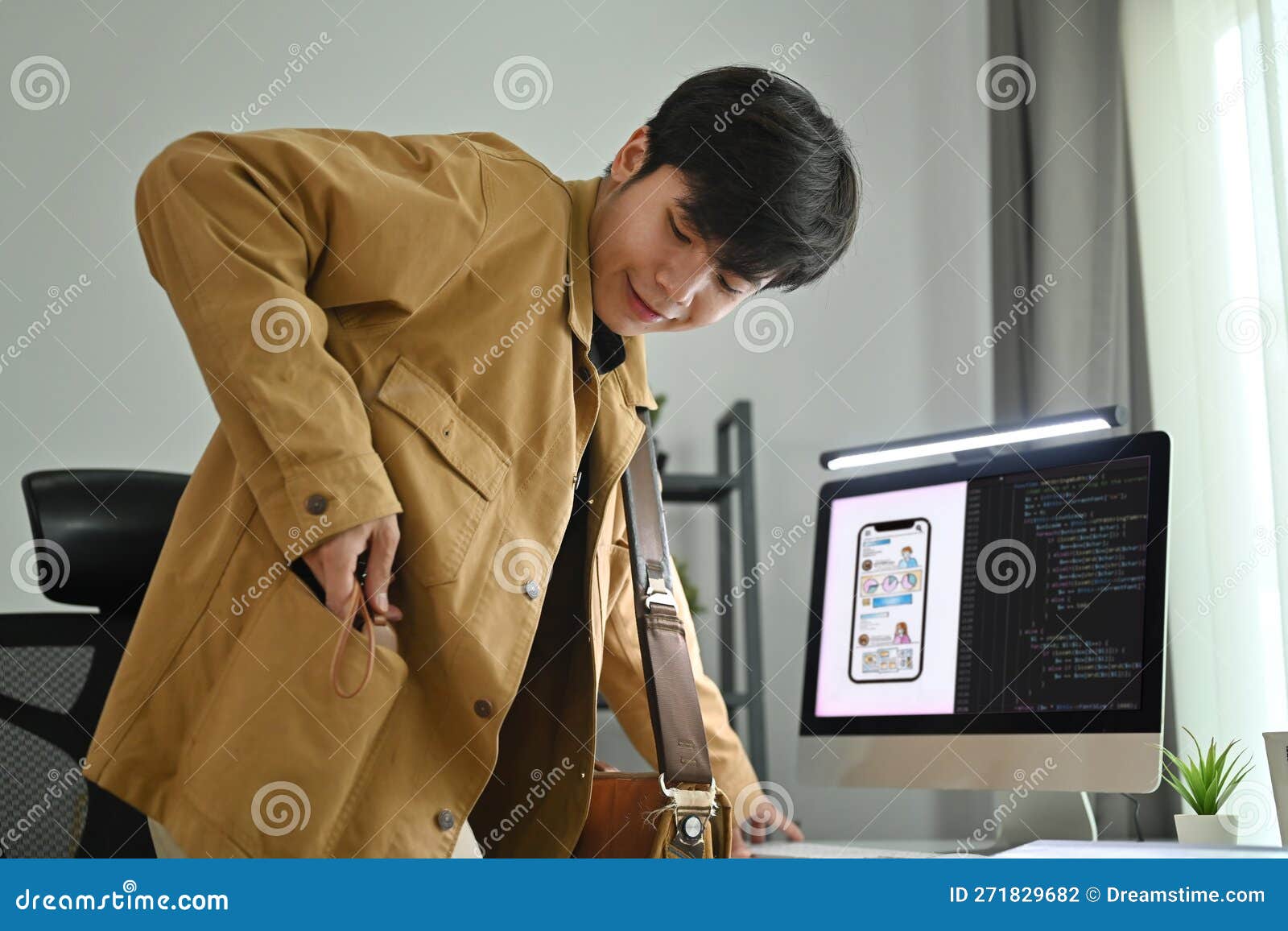 Smiling Asian Male Web Designer Working on Framework of New Application ...