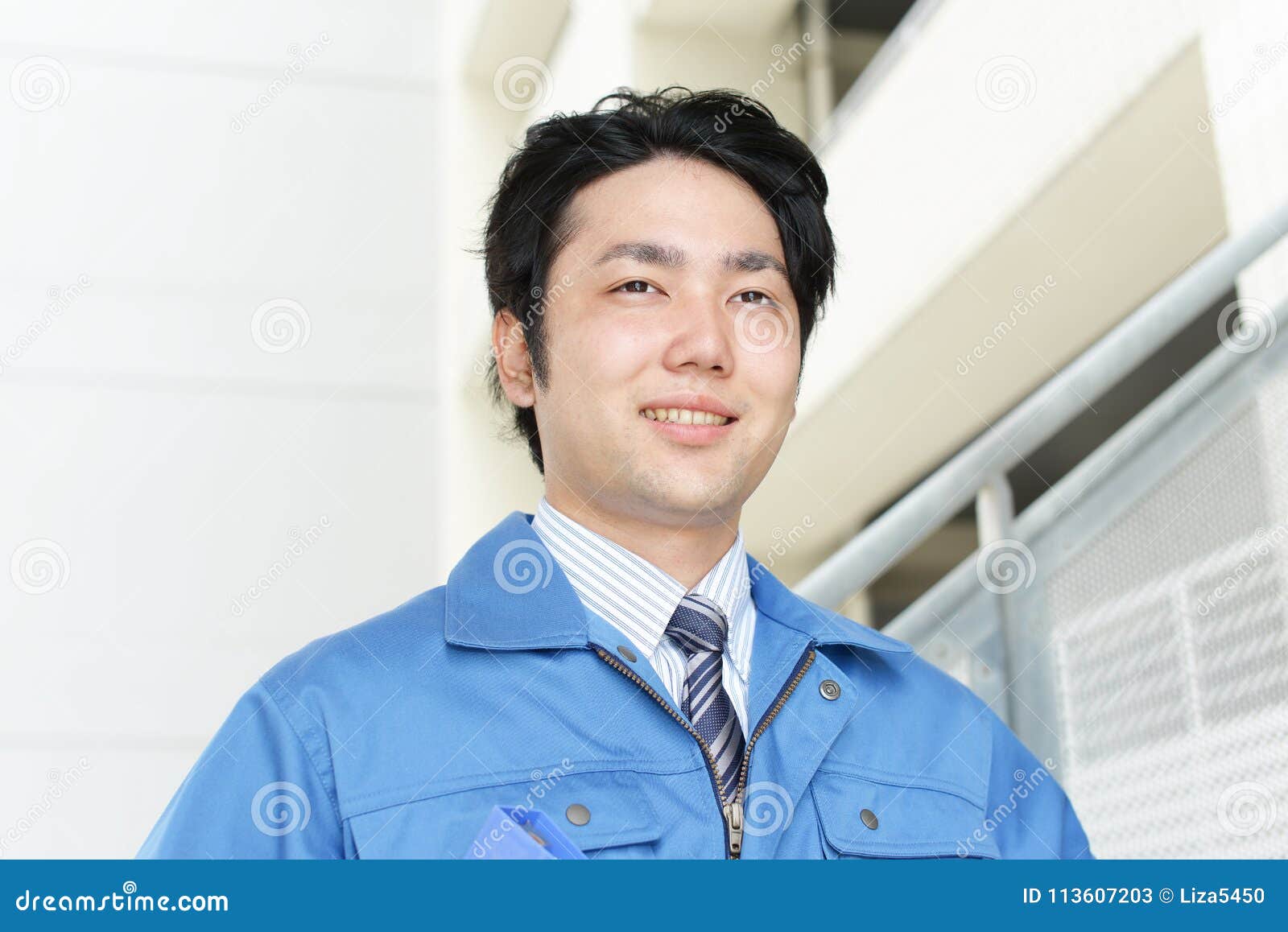 Smiling Asian worker stock image. Image of expression - 113607203