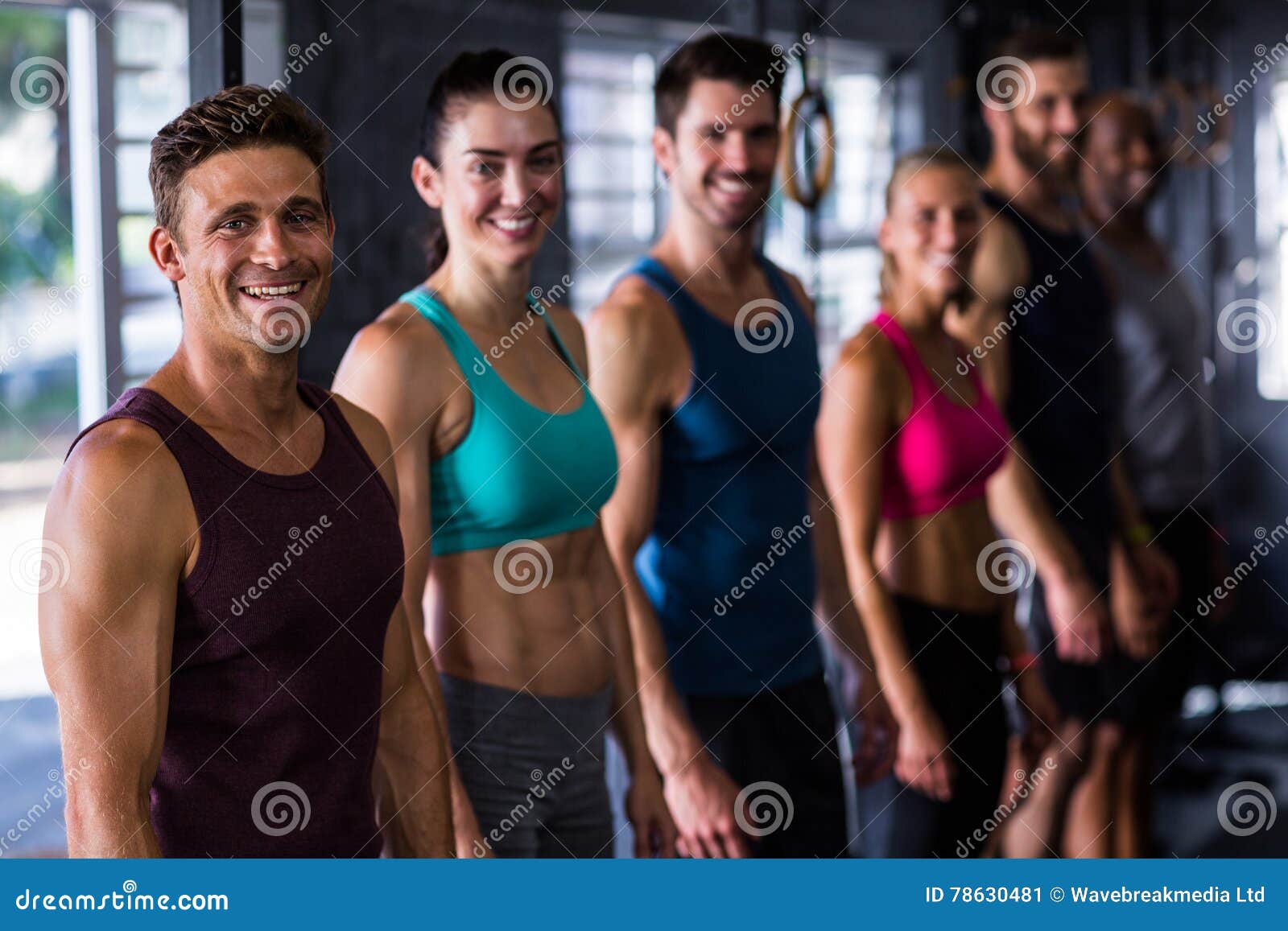 Smiling athletes in gym stock image. Image of focus, black - 78630481
