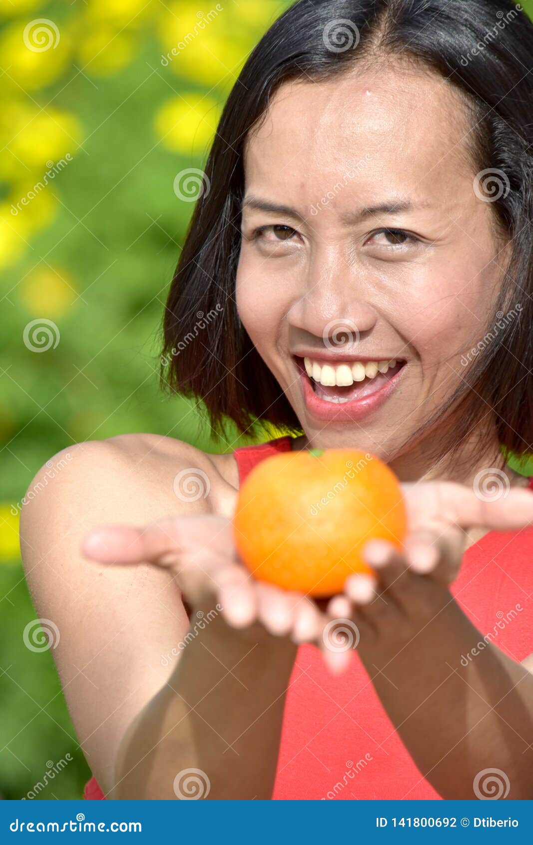 Smiling Attractive Diverse Female with an Orange Stock Photo - Image of ...