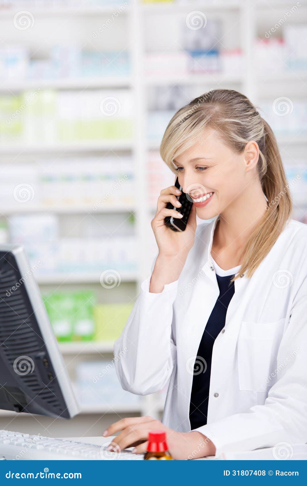 Smiling Attractive Pharmacist Talking at the Phone Stock Photo - Image ...
