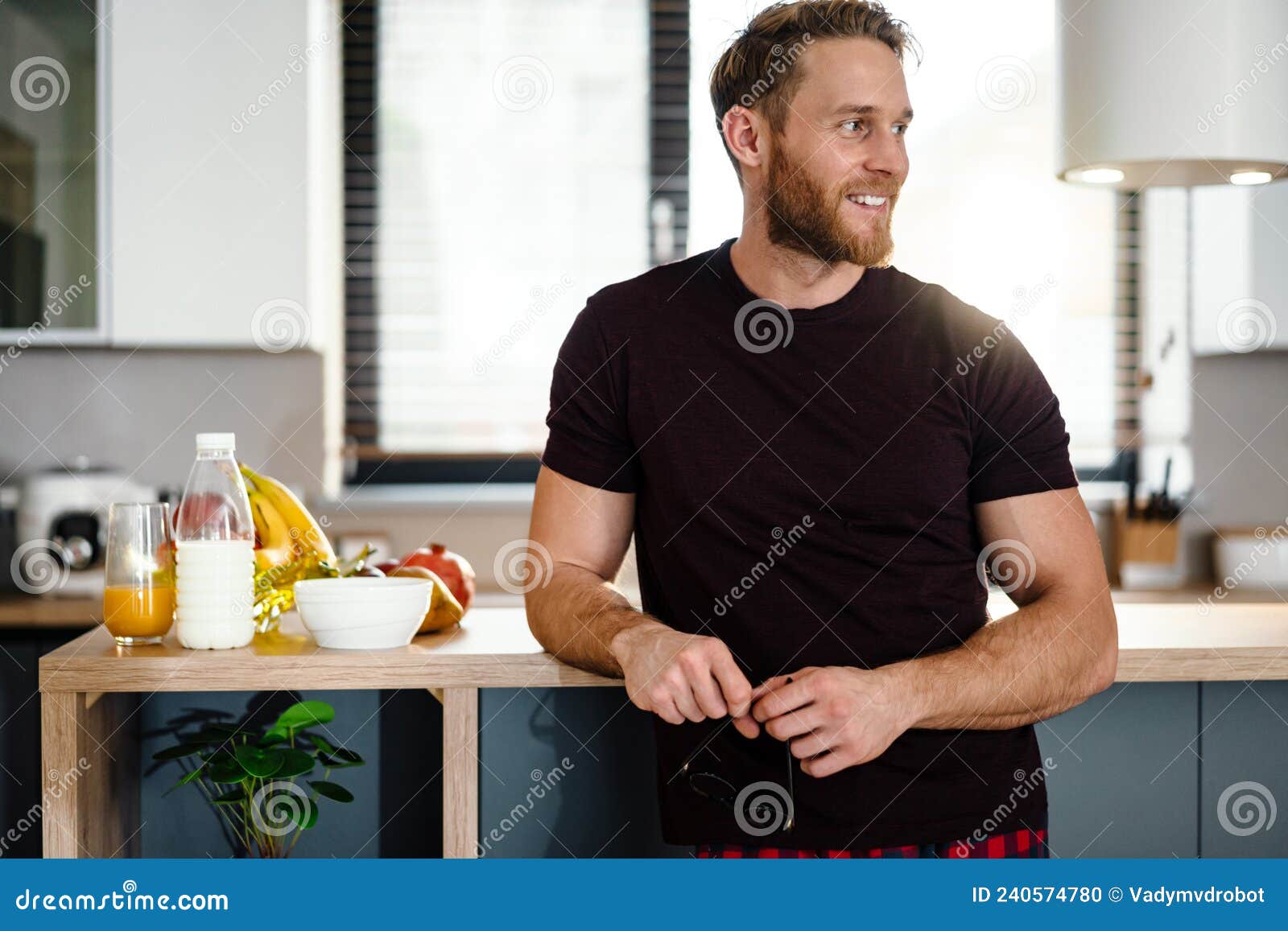 Smiling Attractive Young Man Standing at the Kitchen Counter Stock ...
