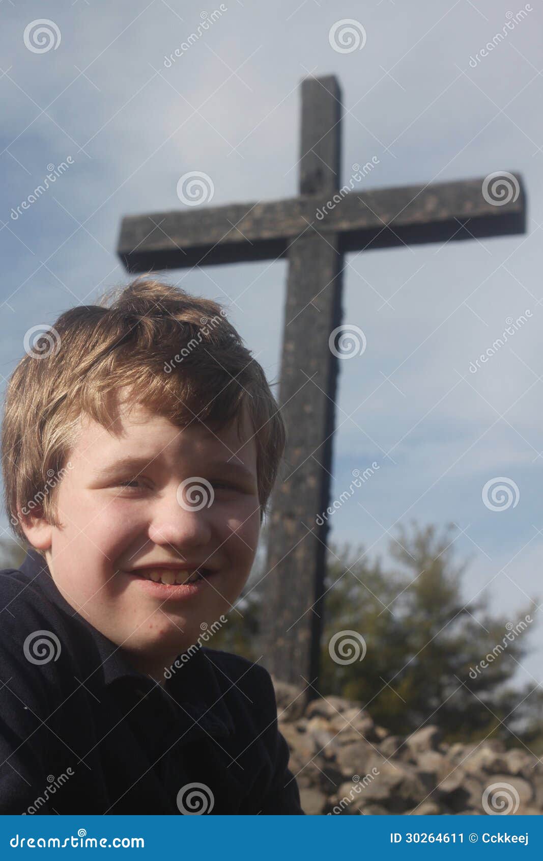Autistic Boy by a Cross stock image. Image of trees, cross - 30264611