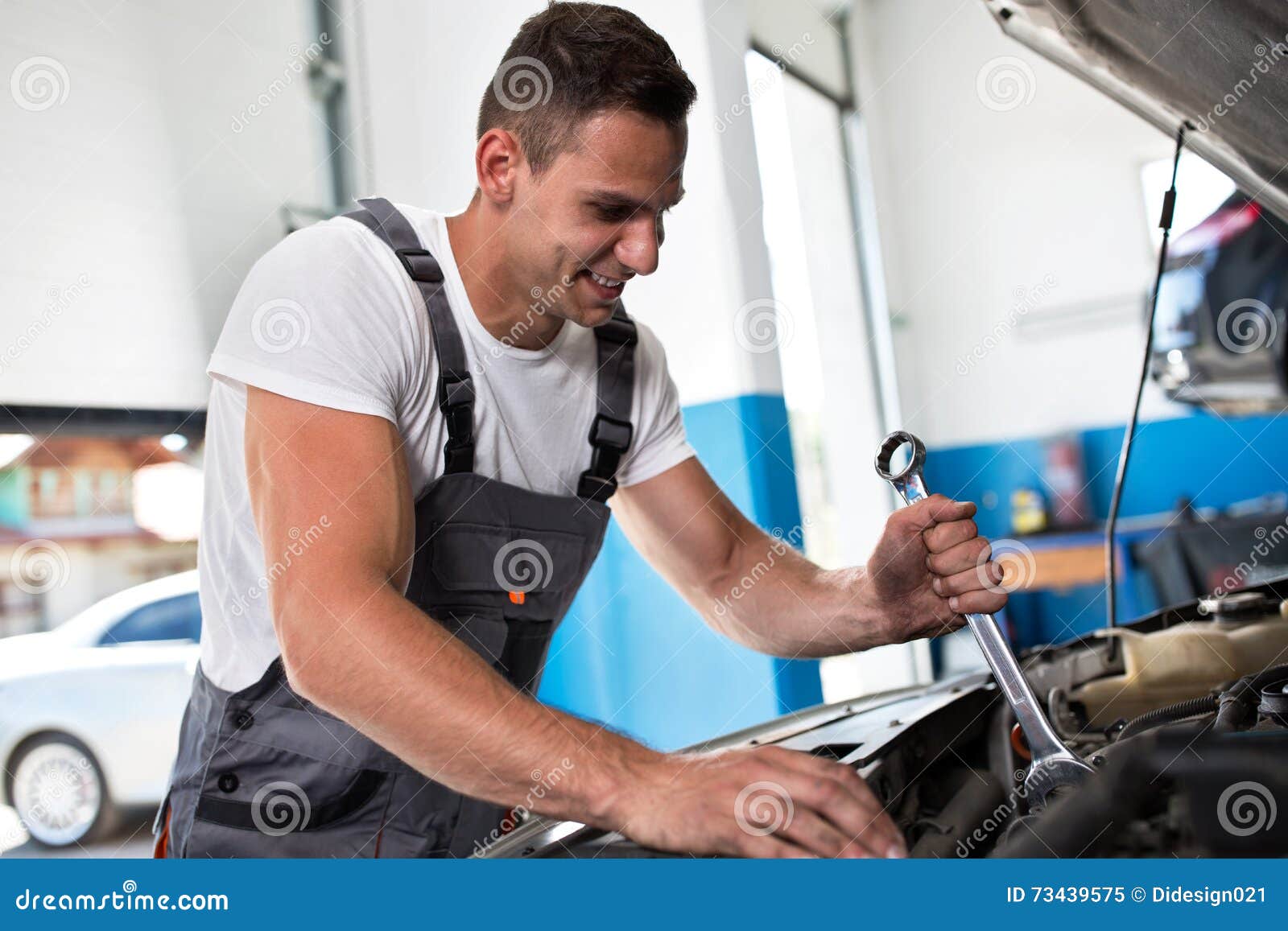 Smiling auto mechanic stock image. Image of service, keys - 73439575