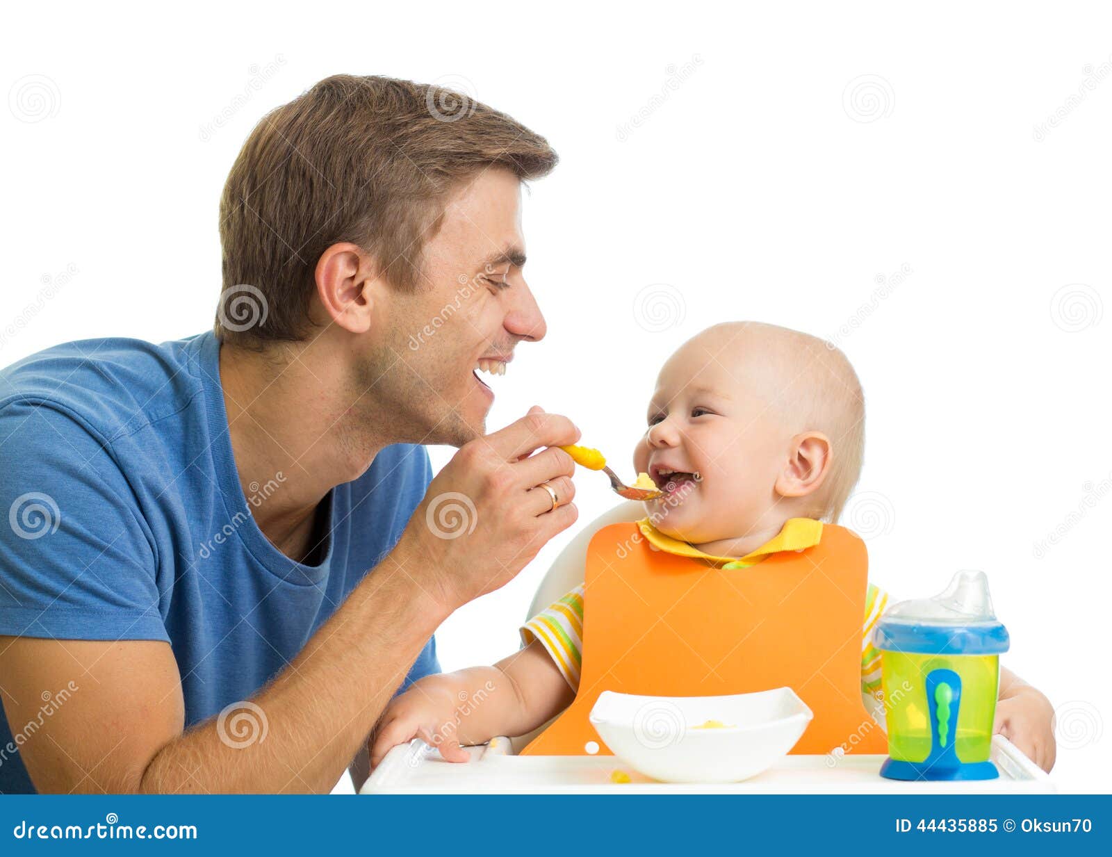 Smiling baby eating food stock image. Image of child - 44435885