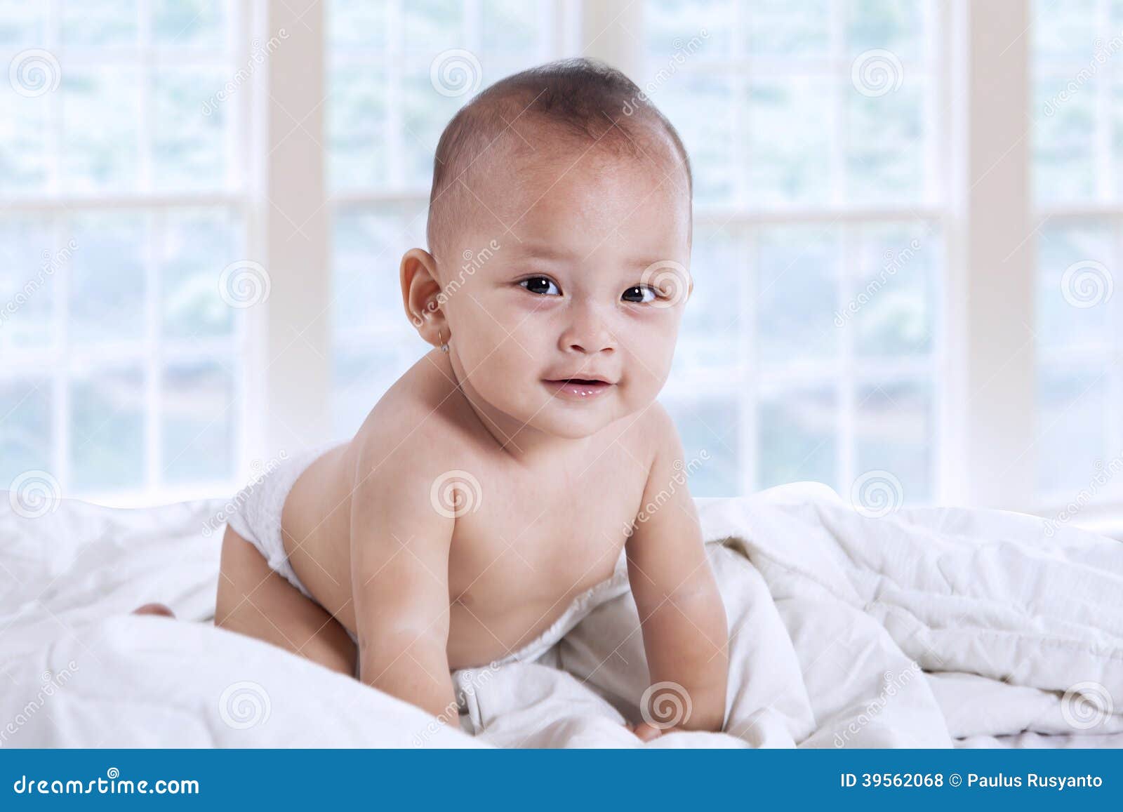 Smiling Baby Looking at Camera Stock Photo - Image of adorable, blanket ...