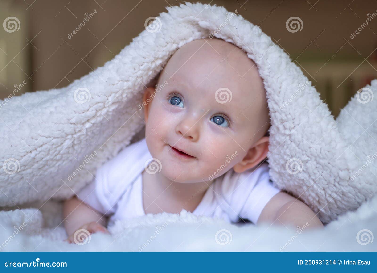 Smiling Baby Looking at Camera Under a White Blanket, Towel Stock Photo ...