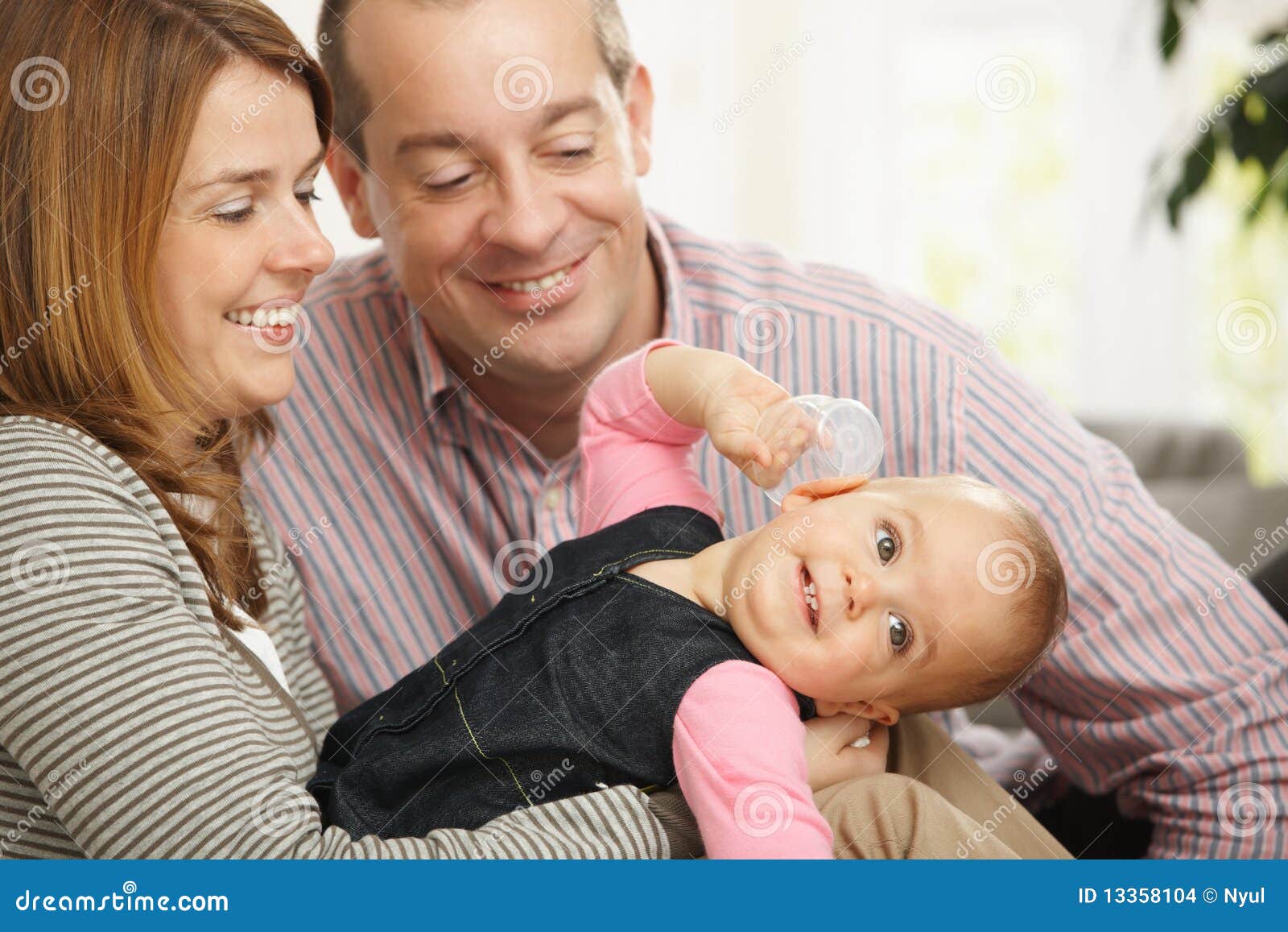 Smiling Baby With Parents Stock Images - Image: 13358104
