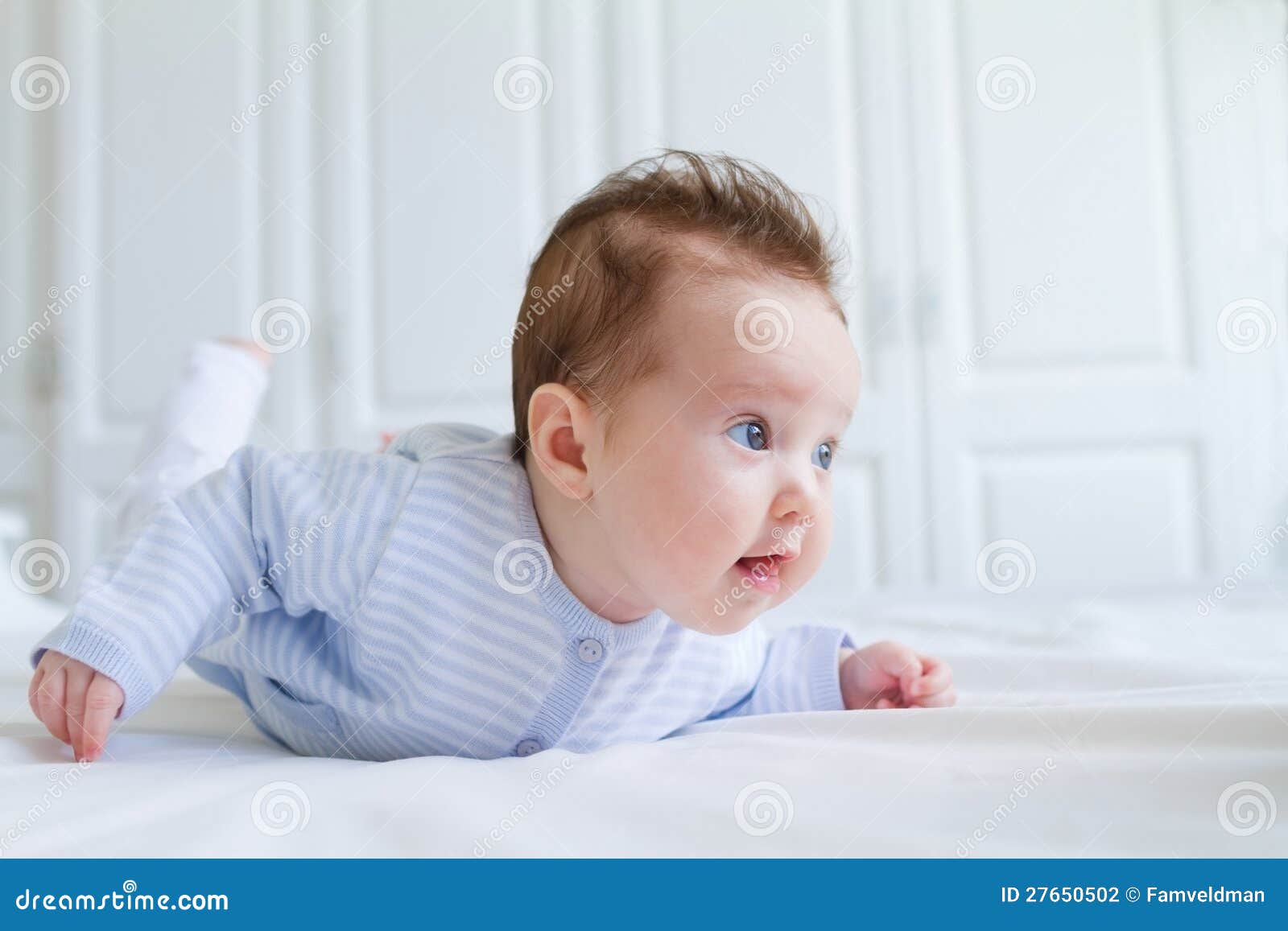 Smiling Baby Tummy Time in a White Nursery Stock Photo - Image of girl ...