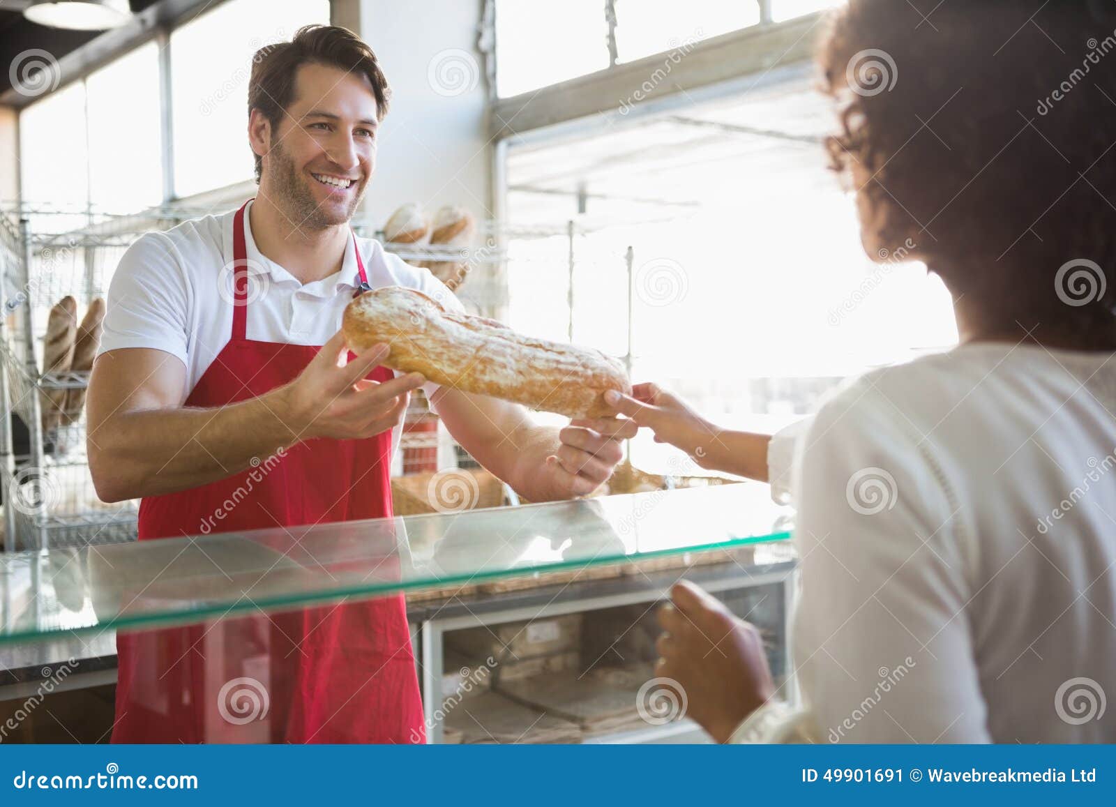 Smiling Baker Doing Loaf Transaction with Customer Stock Image - Image ...