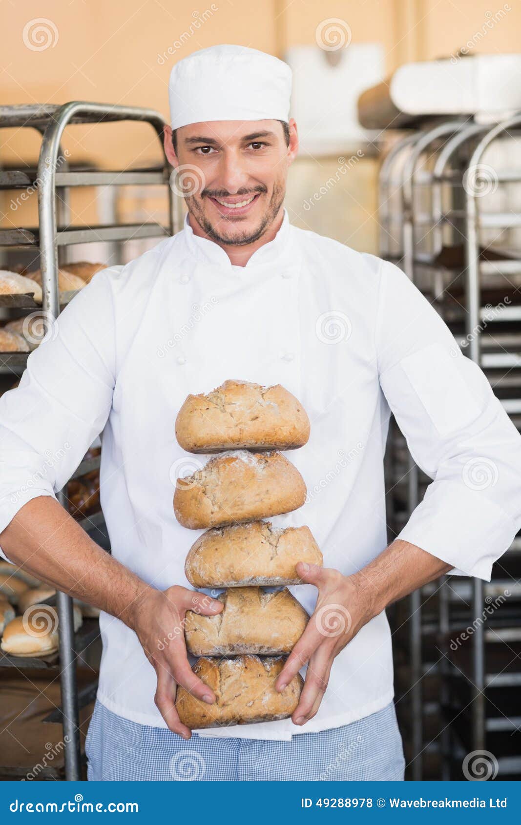 Smiling Baker Holding Fresh Loaves Stock Photo - Image of bakery, adult ...