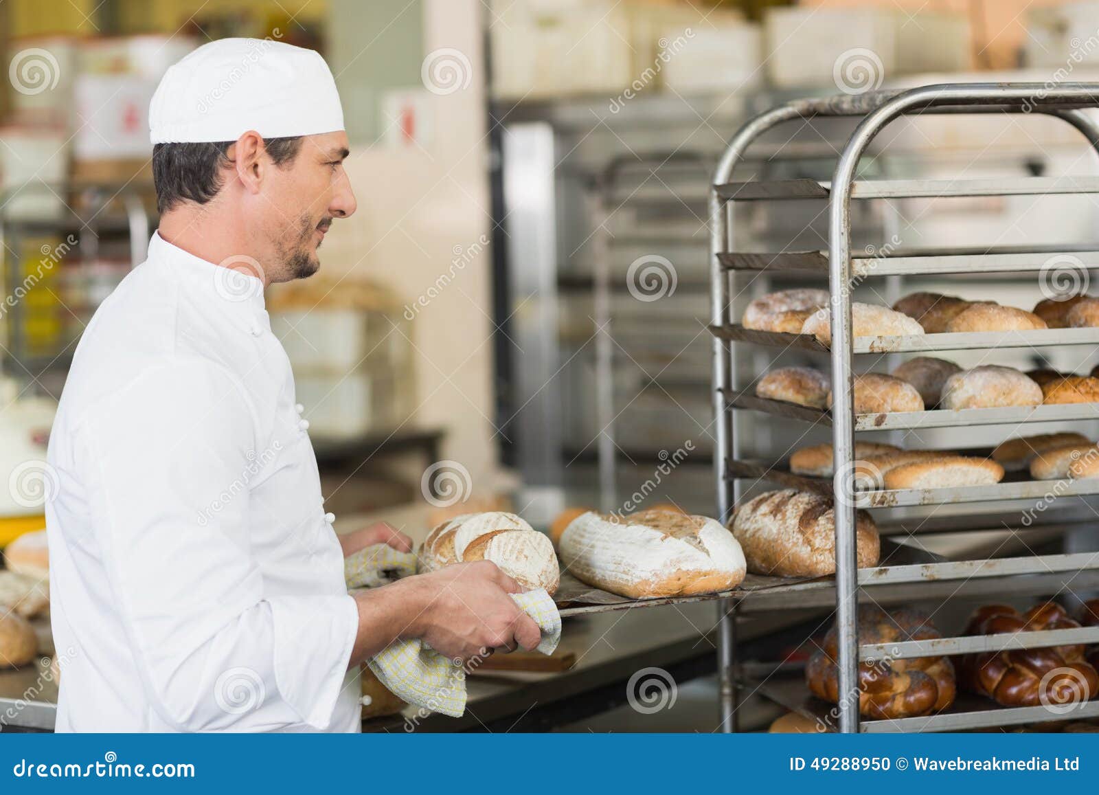 Smiling Baker Holding Tray of Bread Stock Photo - Image of business ...