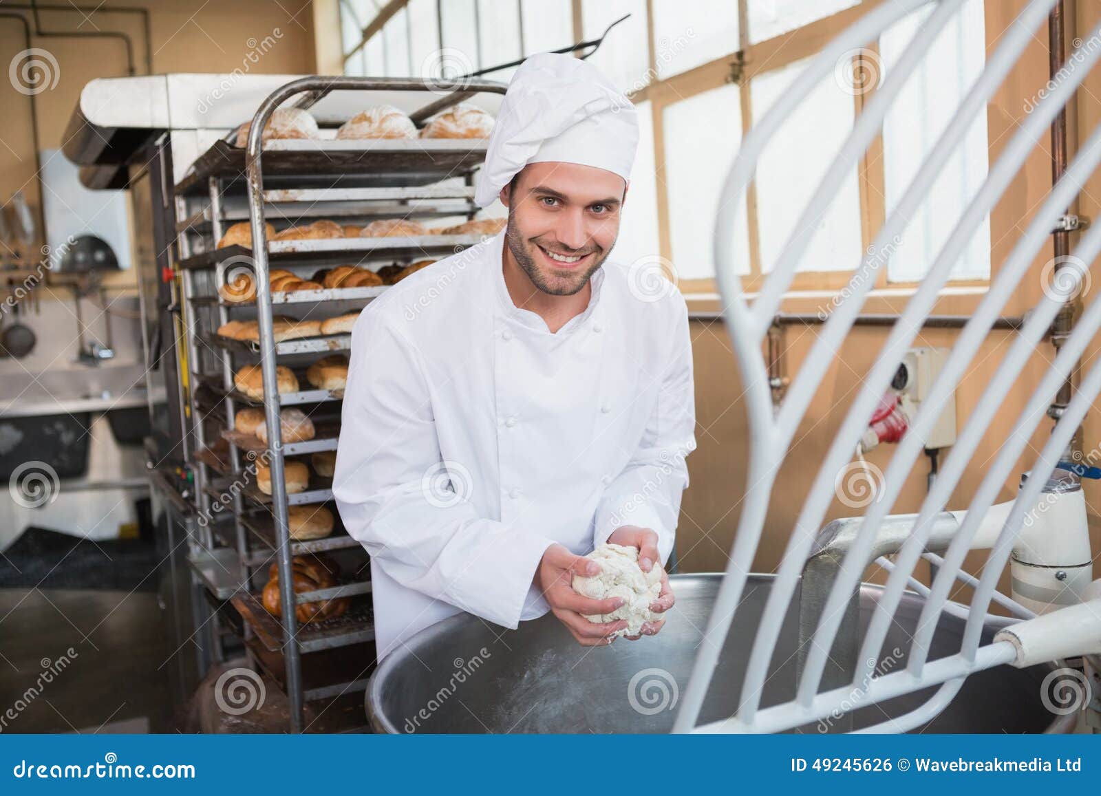 Smiling Baker Preparing Dough in Industrial Mixer Stock Photo - Image ...