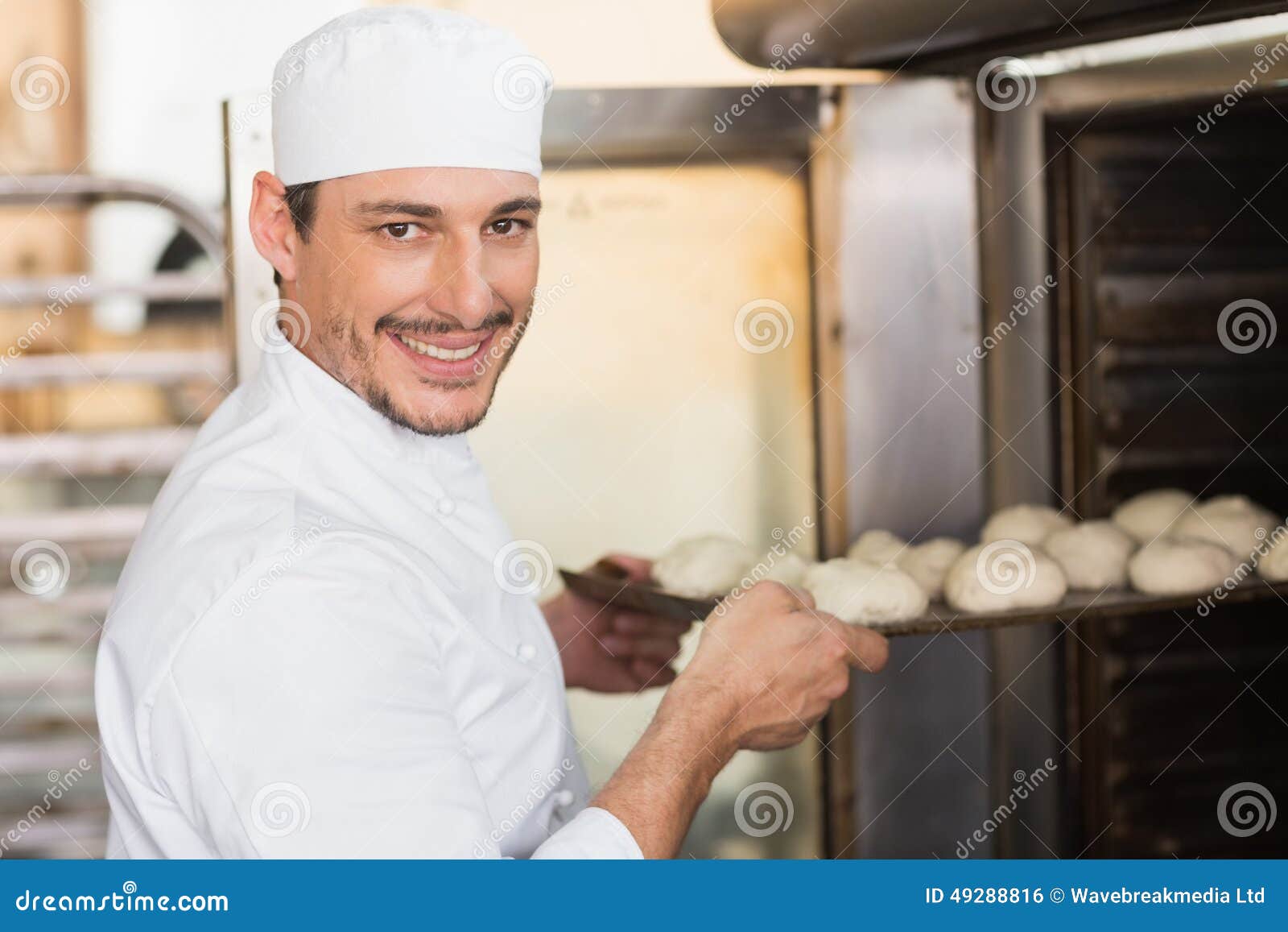 Smiling Baker Putting Dough in Oven Stock Photo - Image of restaurant ...