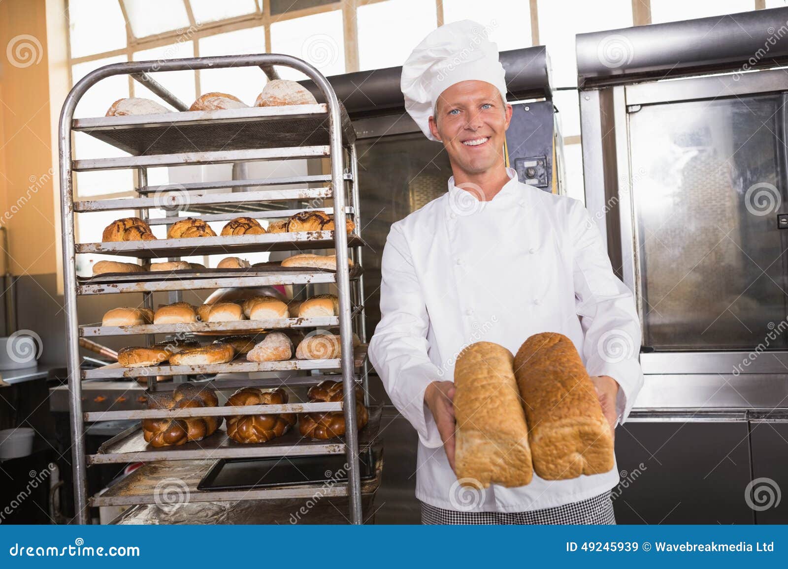 Smiling Baker Showing Loaves of Bread Stock Image - Image of adult ...