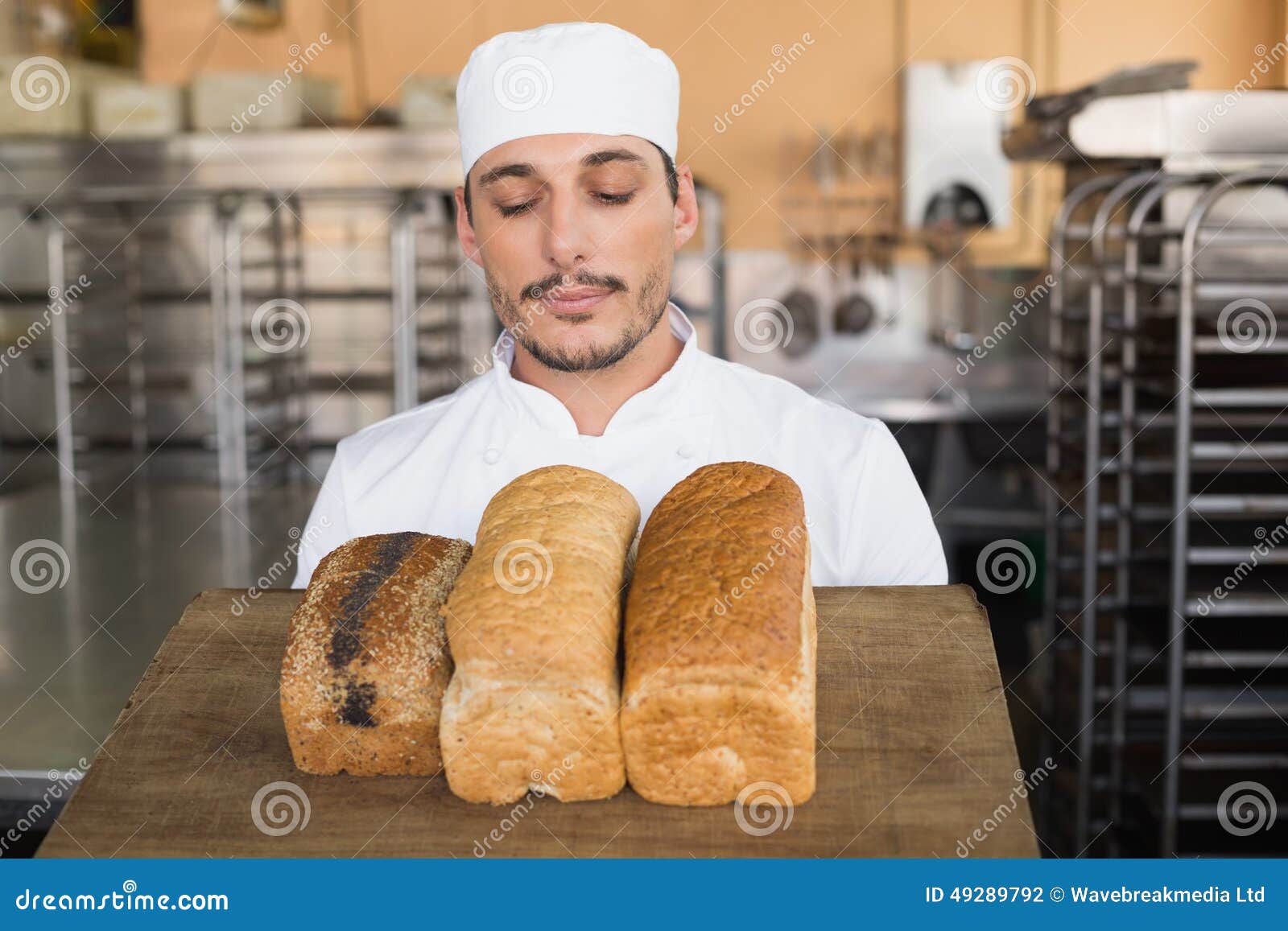 Smiling Baker Showing Loaves of Bread Stock Photo - Image of bakery ...