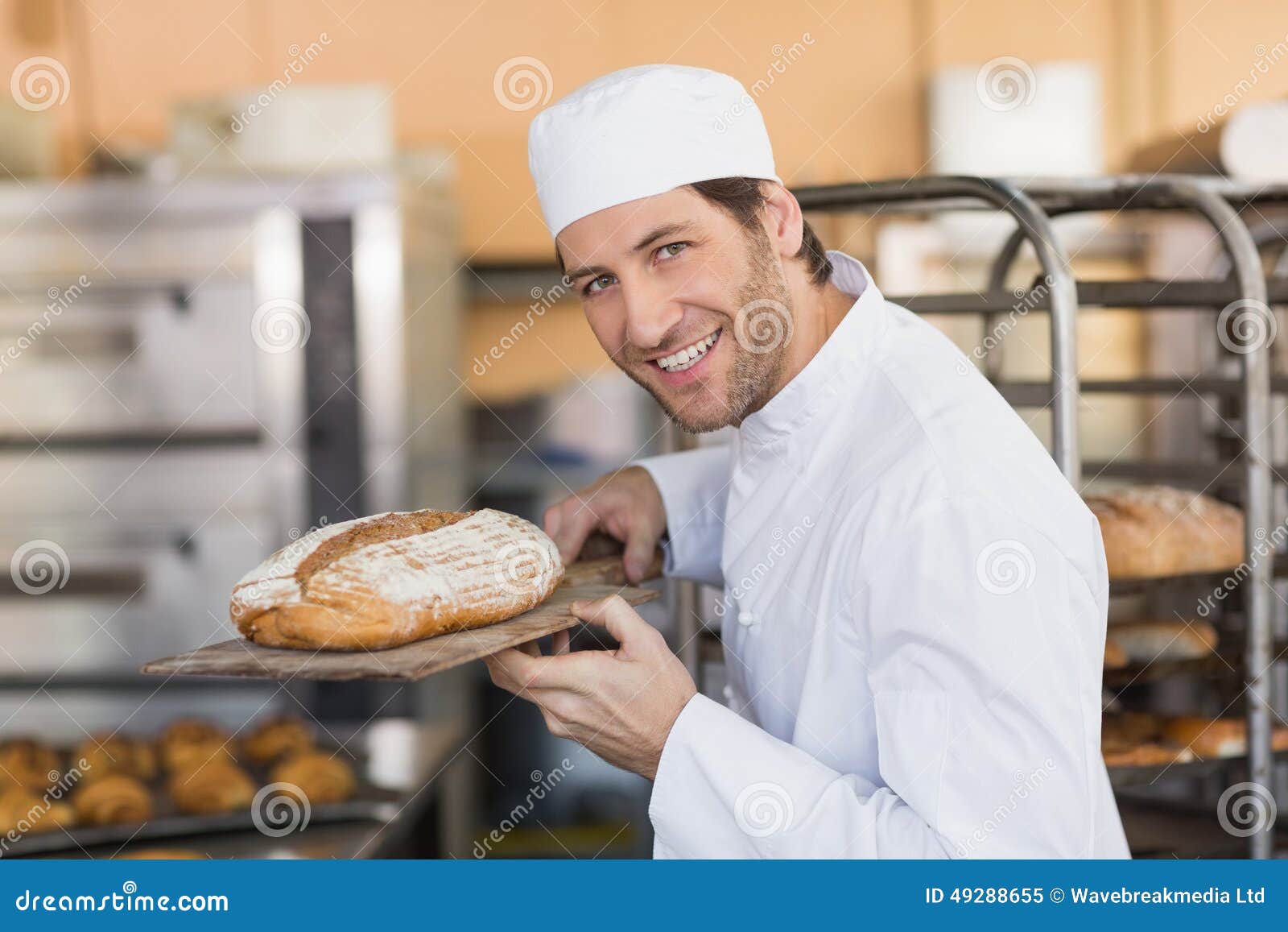 Smiling Baker Smelling Fresh Bread Stock Image - Image of person, hotel ...