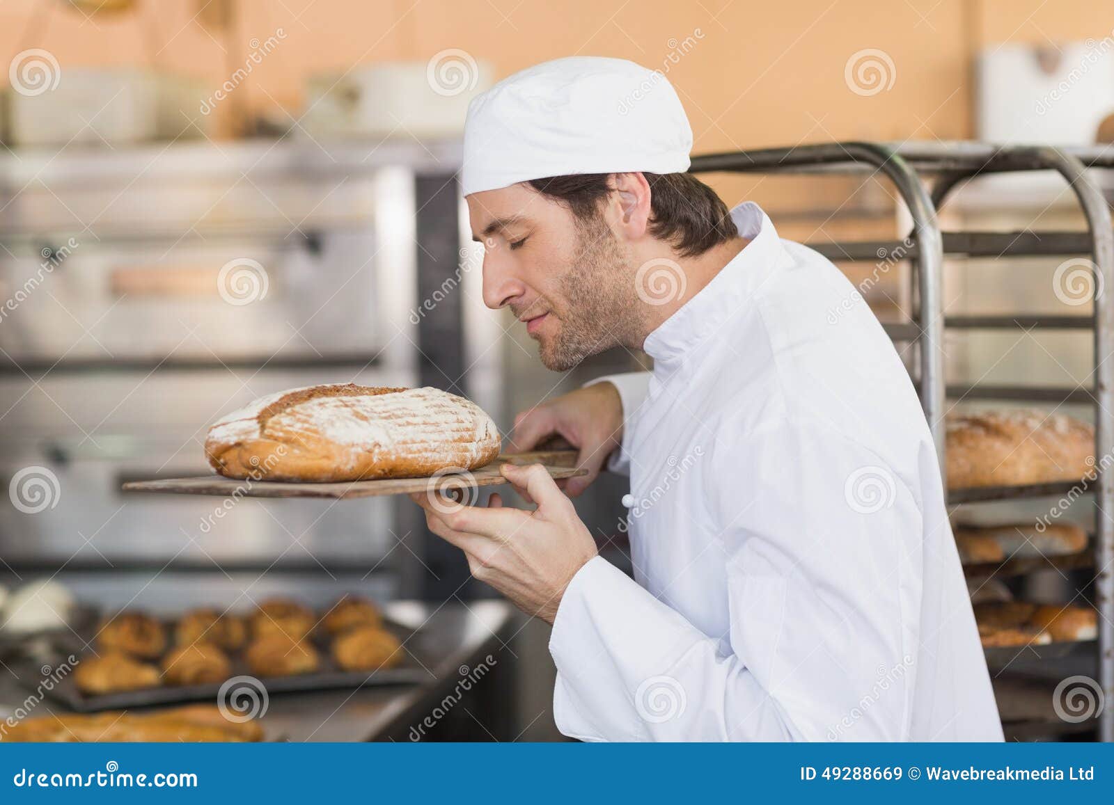 Smiling Baker Smelling Fresh Bread Stock Image - Image of building ...