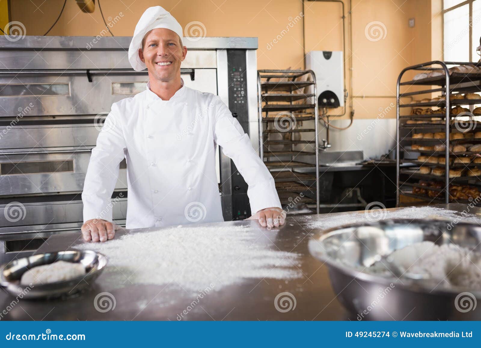 Smiling Baker Standing Behind the Counter Stock Photo - Image of ...