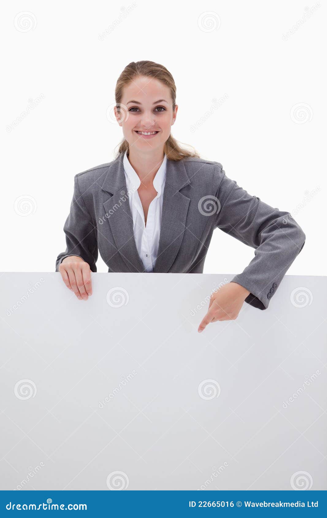 Smiling Bank Employee Pointing Down at Blank Sign Stock Photo - Image ...