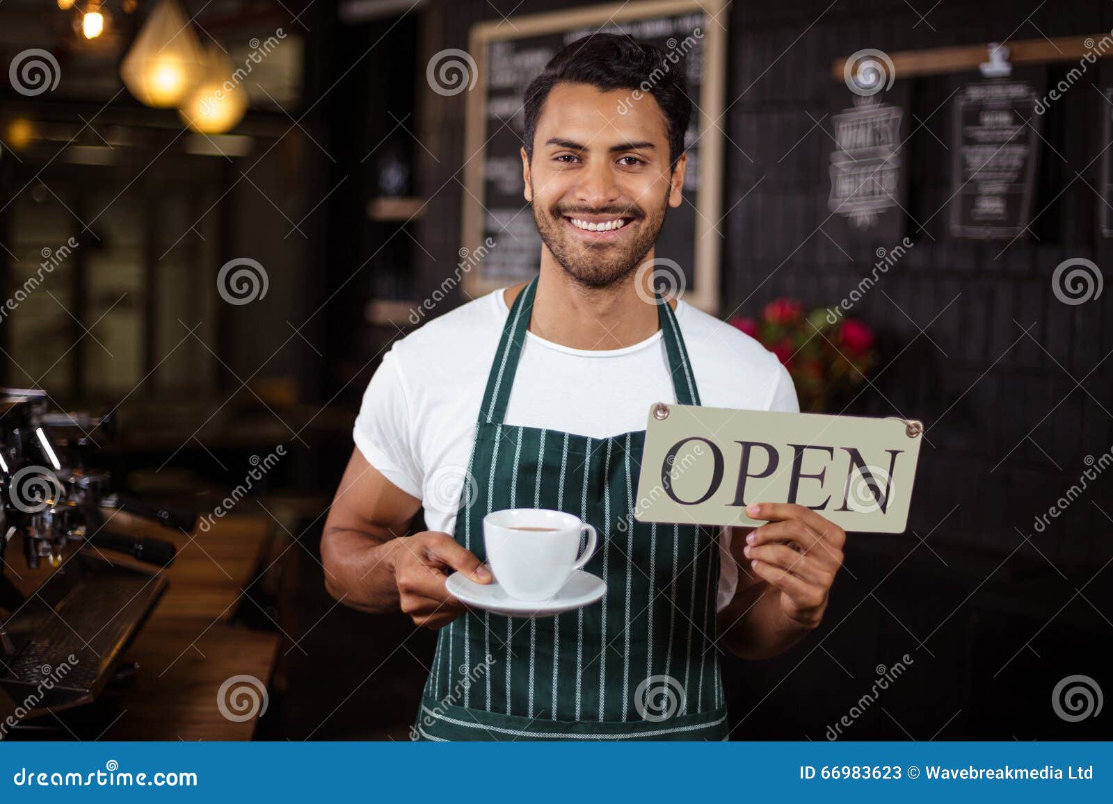 Smiling Barista Holding Coffee and Open Sign Stock Image - Image of ...