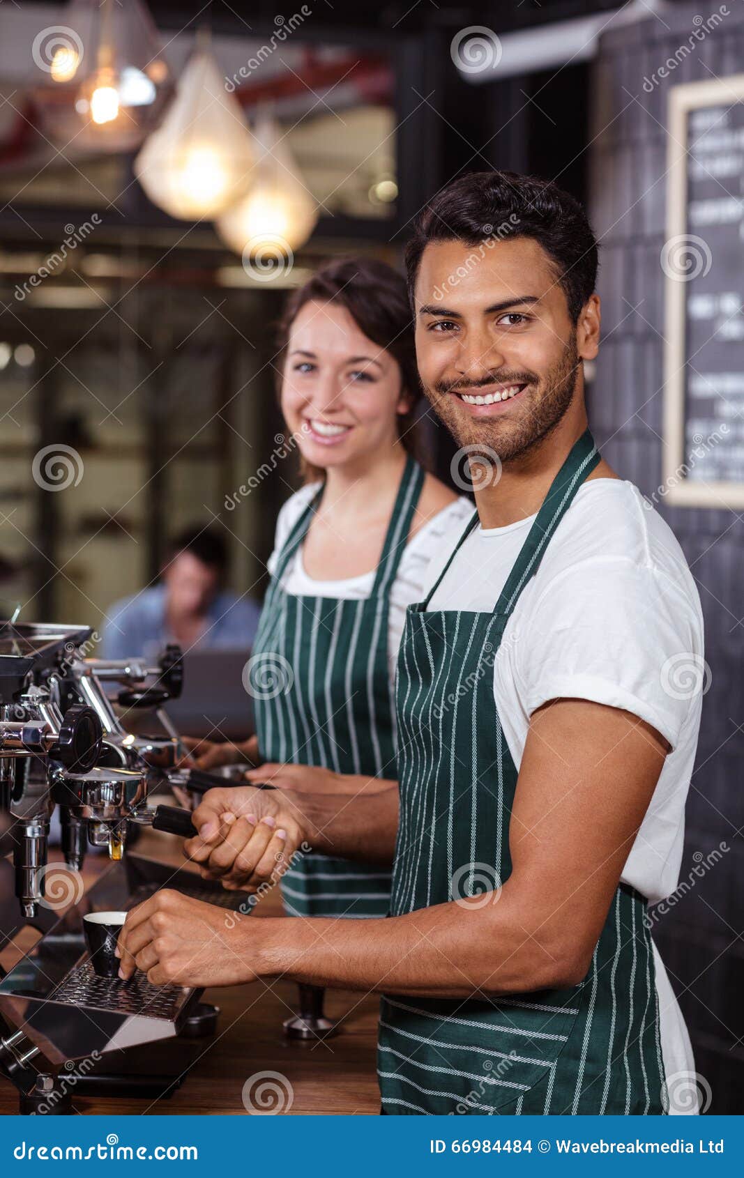 Smiling Baristas Using Coffee Machine Stock Photo - Image of occupation ...