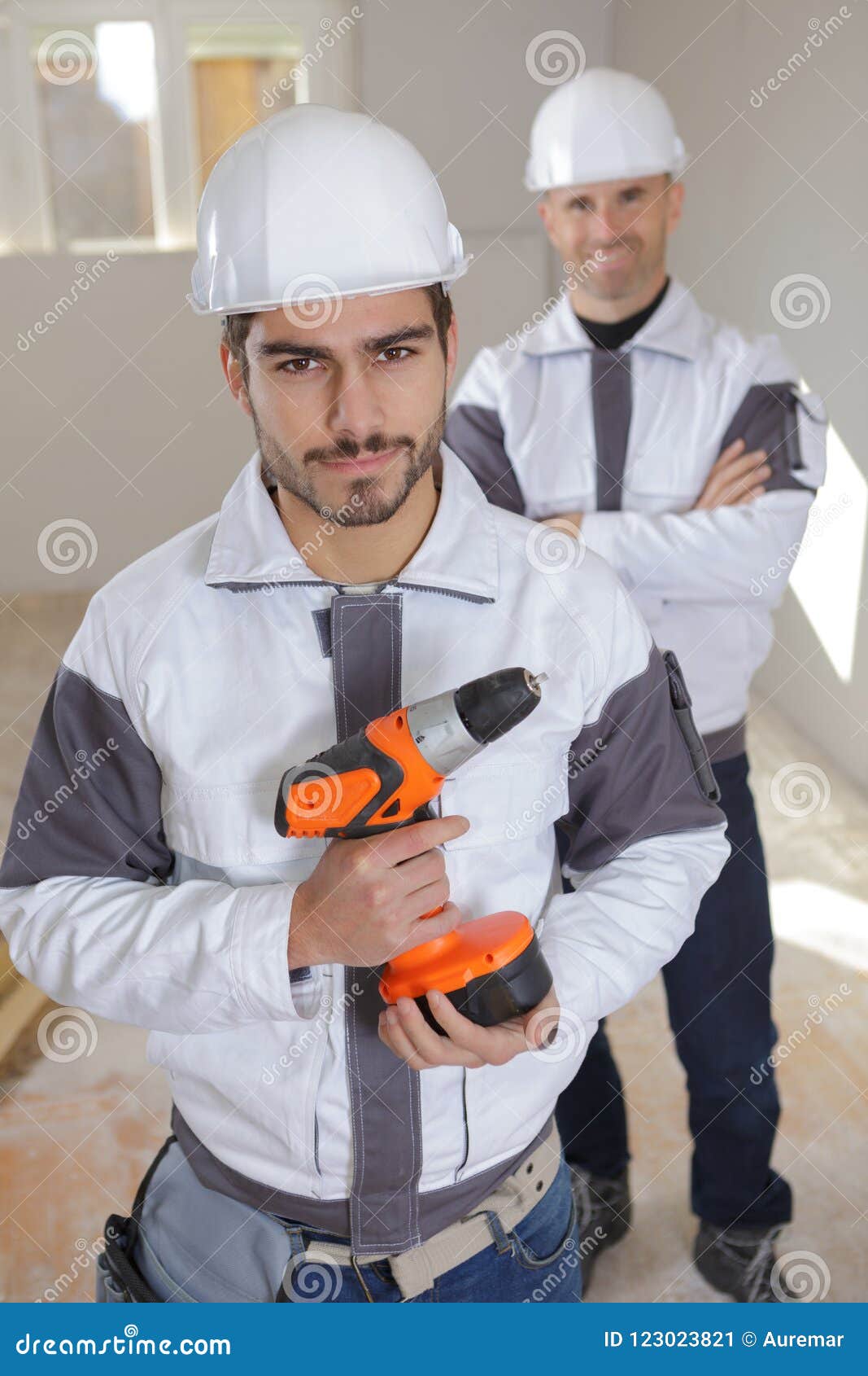 Smiling Beard Man with Drill at Construction Site Stock Image - Image ...