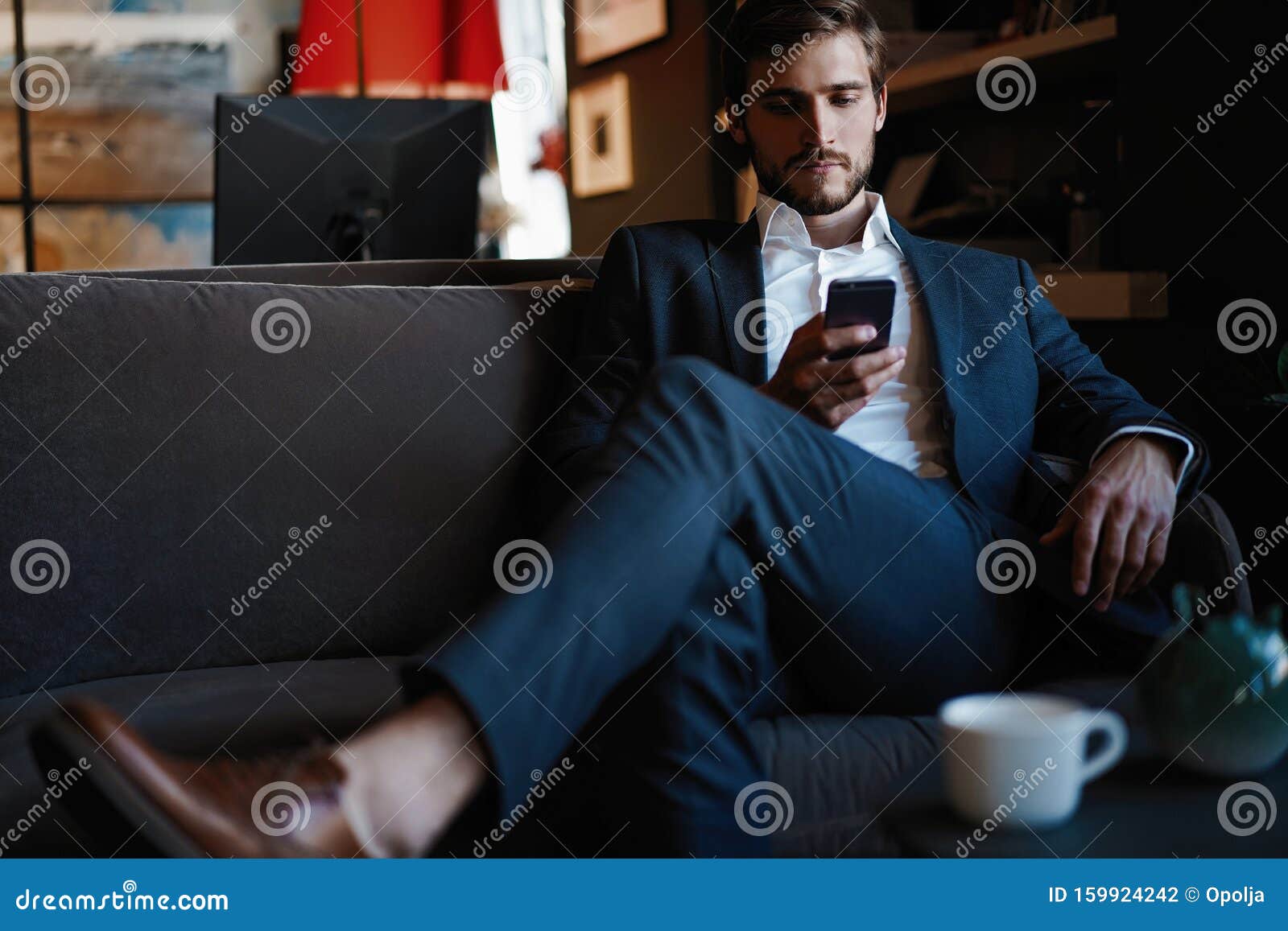 Smiling Bearded Man Making Text Message on Smartphone while Sitting ... Smiling Bearded Man Making Text Message on Smartphone while Sitting ...