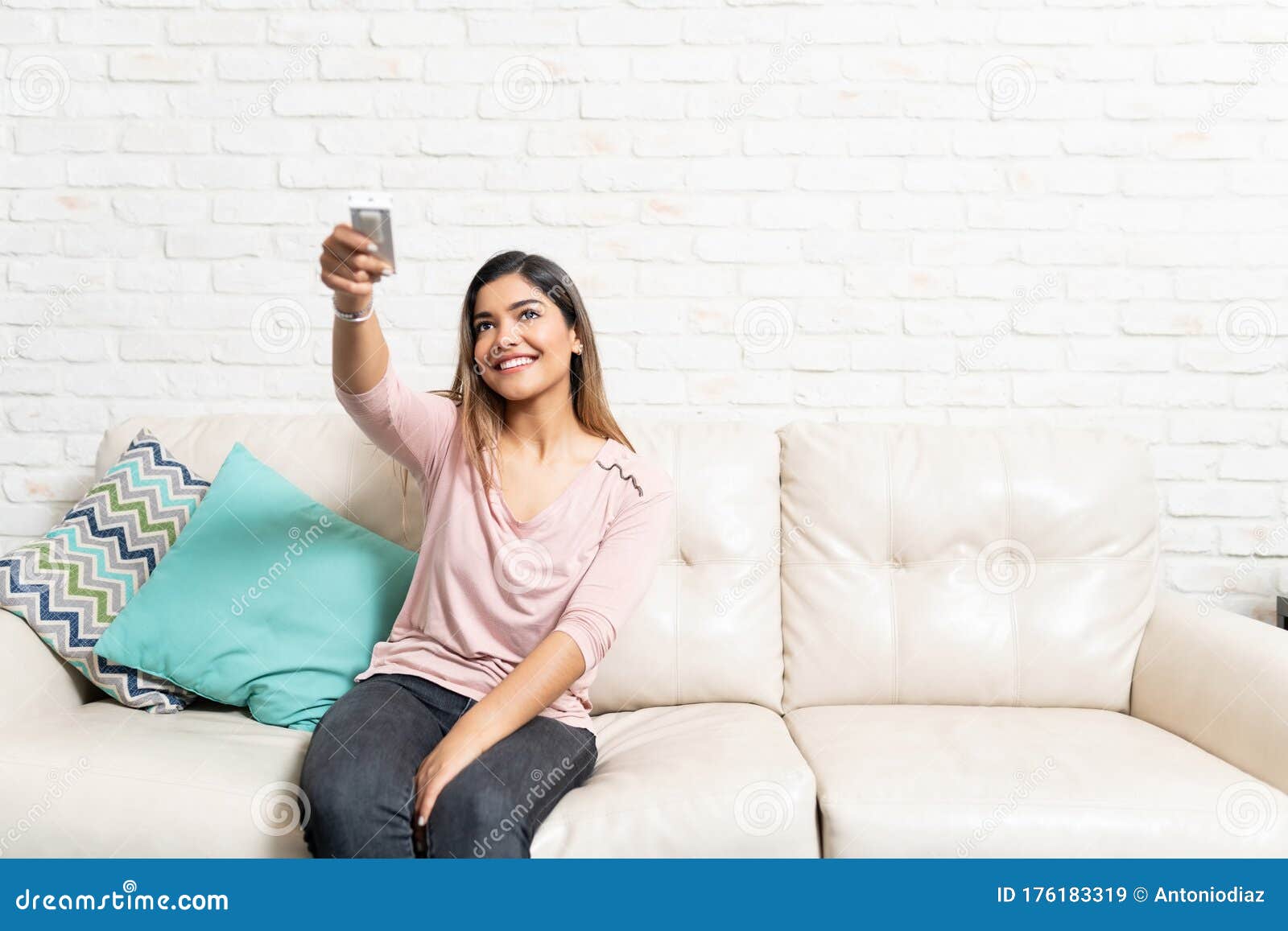 Smiling Woman Using Remote Control at Home Stock Image - Image of ... Smiling Woman Using Remote Control at Home Stock Image - Image of ...