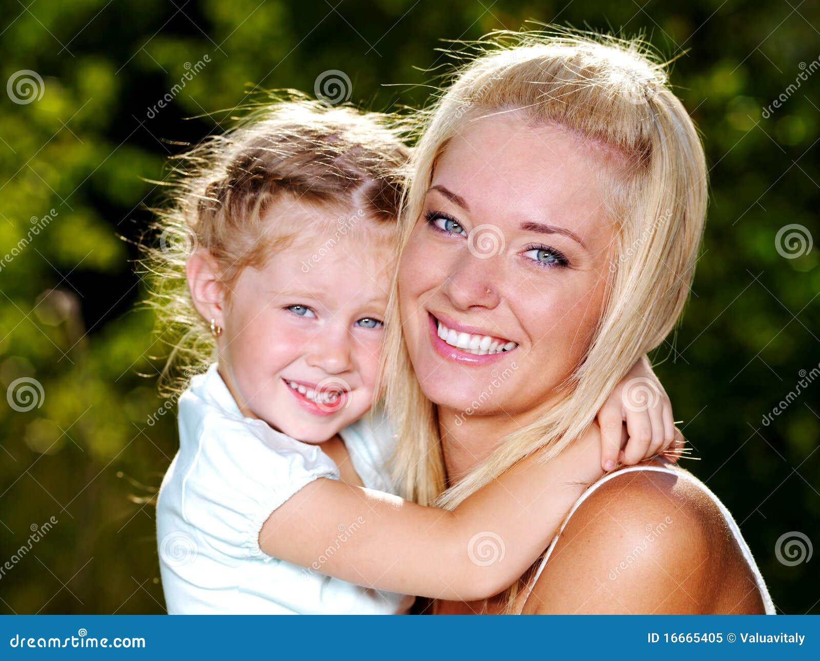 Smiling and Beautiful Mother and Little Daughter Stock Image - Image of ...