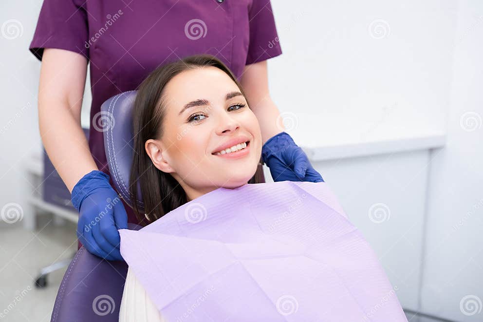 Smiling Beautiful Patient Before Treatment In A Dental Office Stock