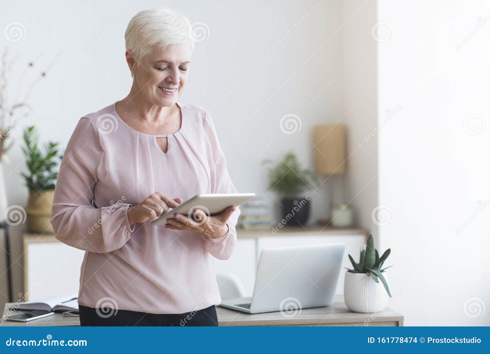 Smiling Beautiful Senior Woman Using Digital Tablet Stock Photo - Image ... Smiling Beautiful Senior Woman Using Digital Tablet Stock Photo - Image ...