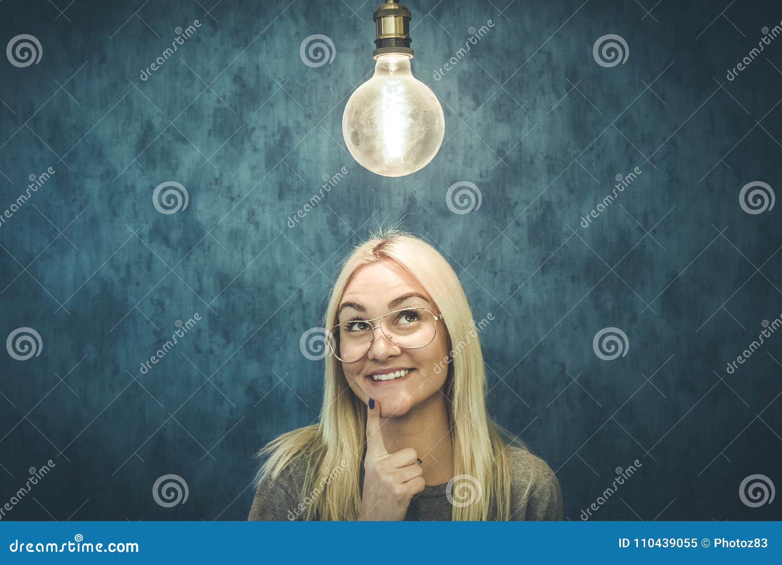 Smiling Beautiful Woman Having an Idea with Light Bulb Over Her Head ... Smiling Beautiful Woman Having an Idea with Light Bulb Over Her Head ...
