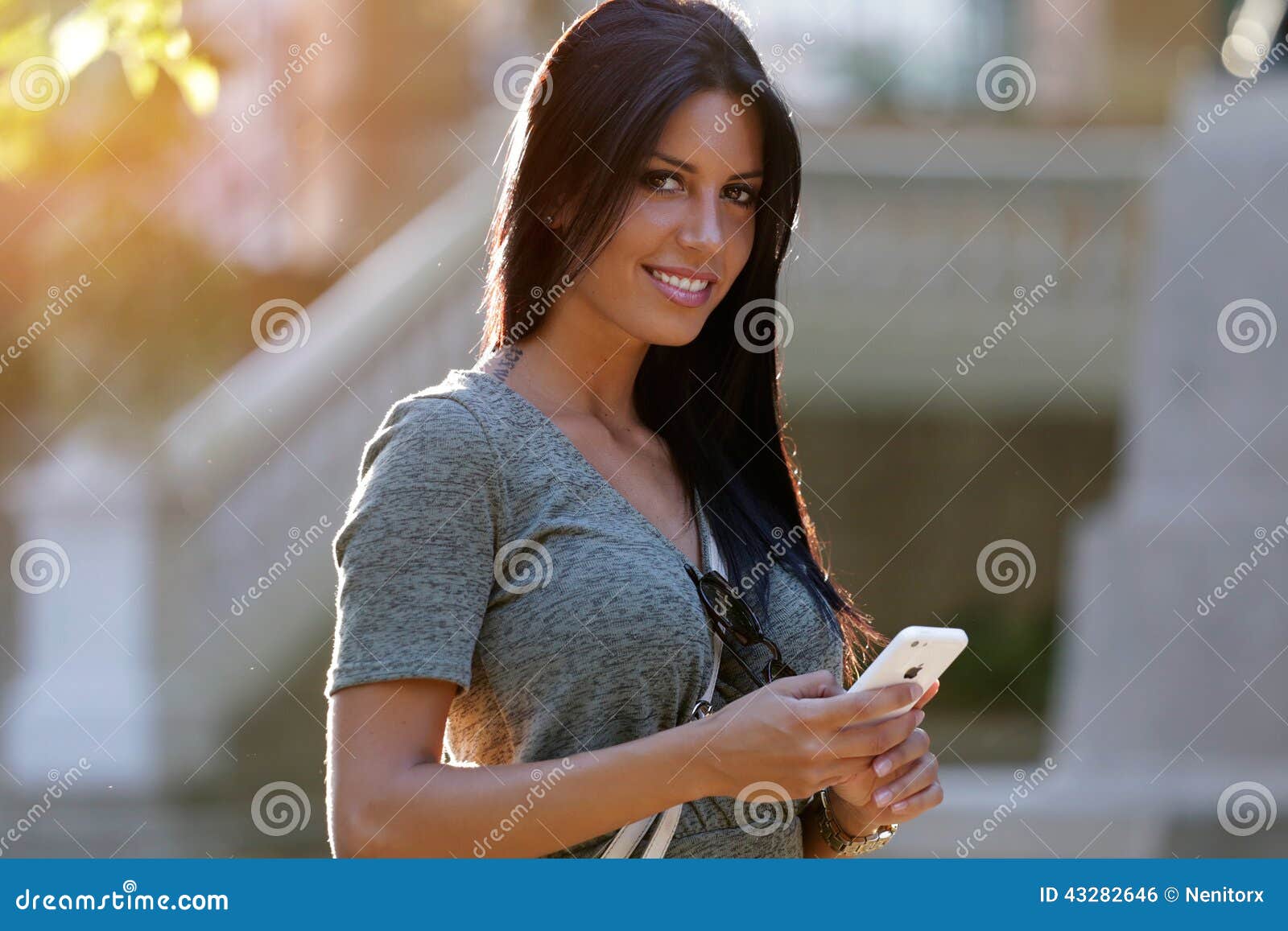 Smiling Beautiful Woman Texting with Her Phone in the Garden. Stock ... Smiling Beautiful Woman Texting with Her Phone in the Garden. Stock ...