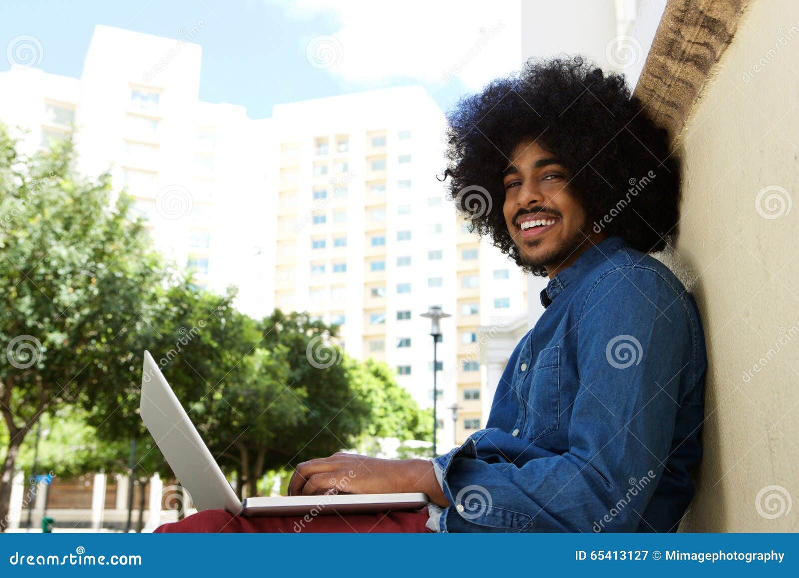 Smiling Black Man Using Laptop in the City Stock Image - Image of ...