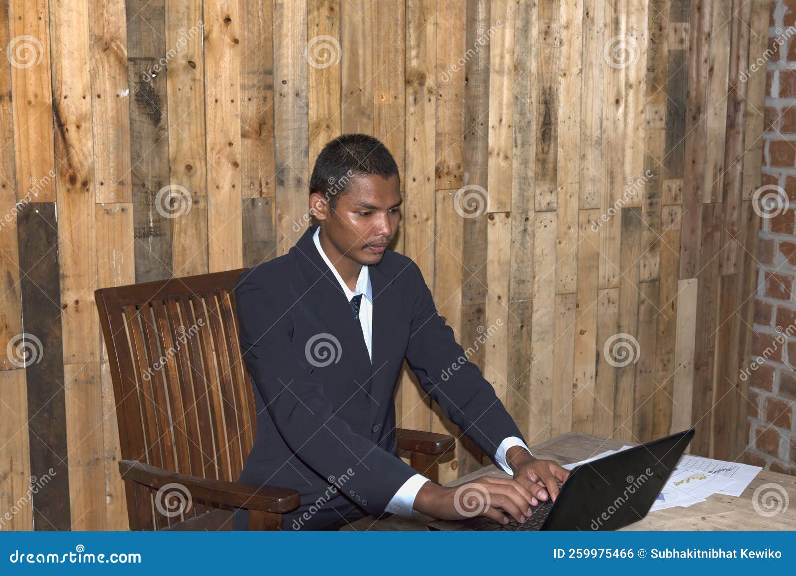 A Smiling Black Manager Uses a Laptop. Stock Photo - Image of ...
