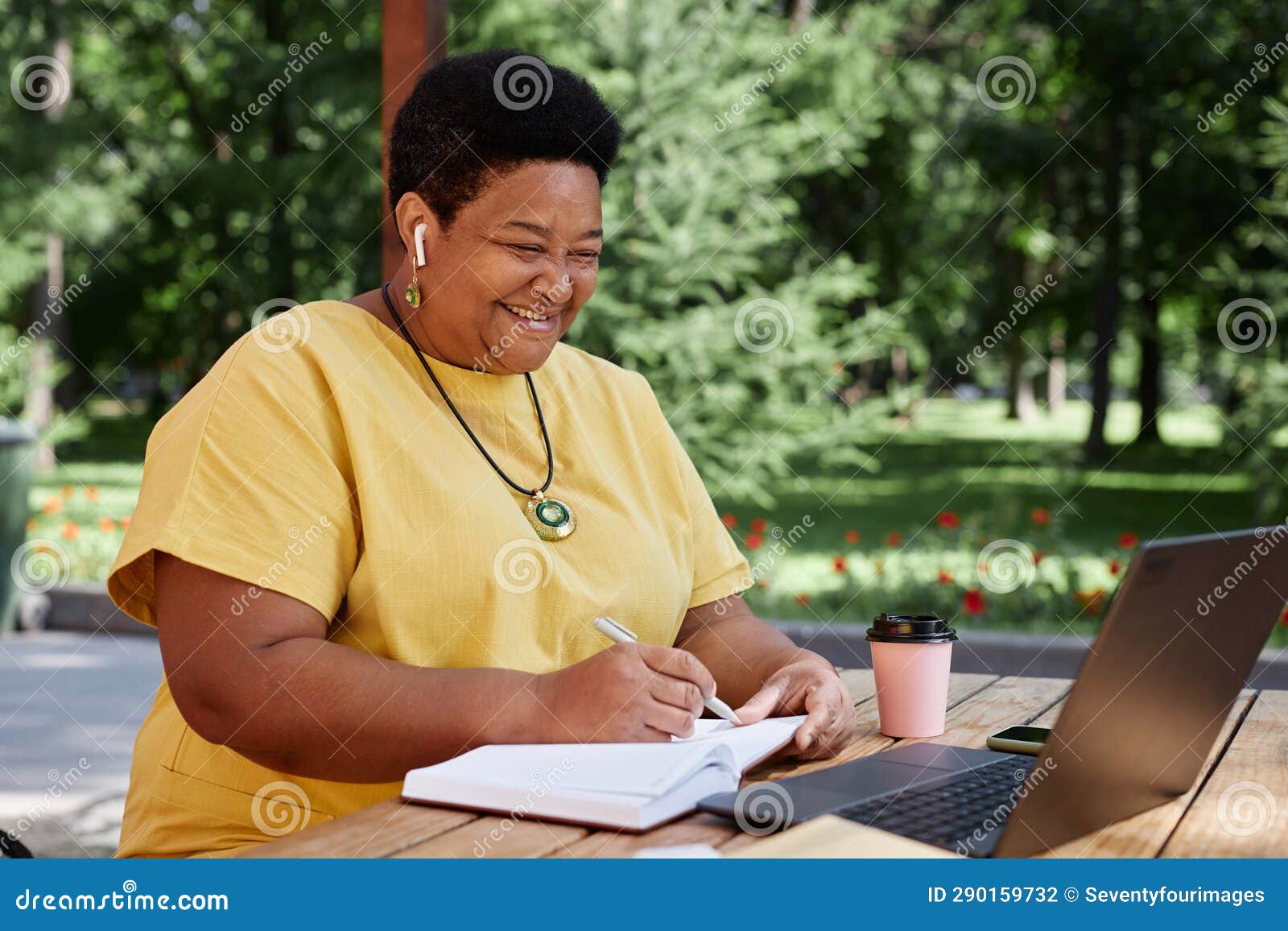Smiling Black Senior Woman Using Laptop Computer Outdoors and Using ...