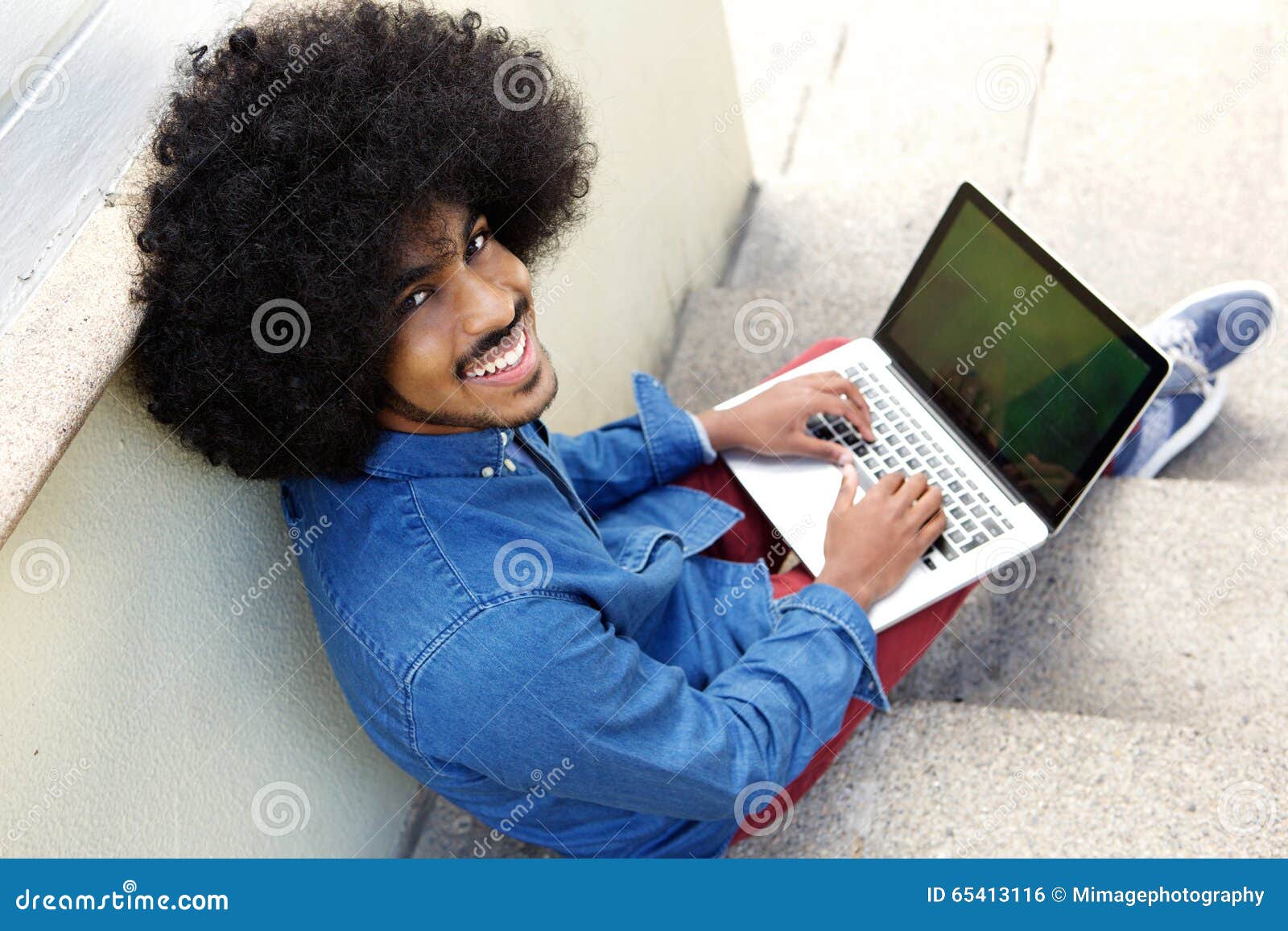 Smiling Black Young Man Using Laptop Stock Photo - Image of adult ...