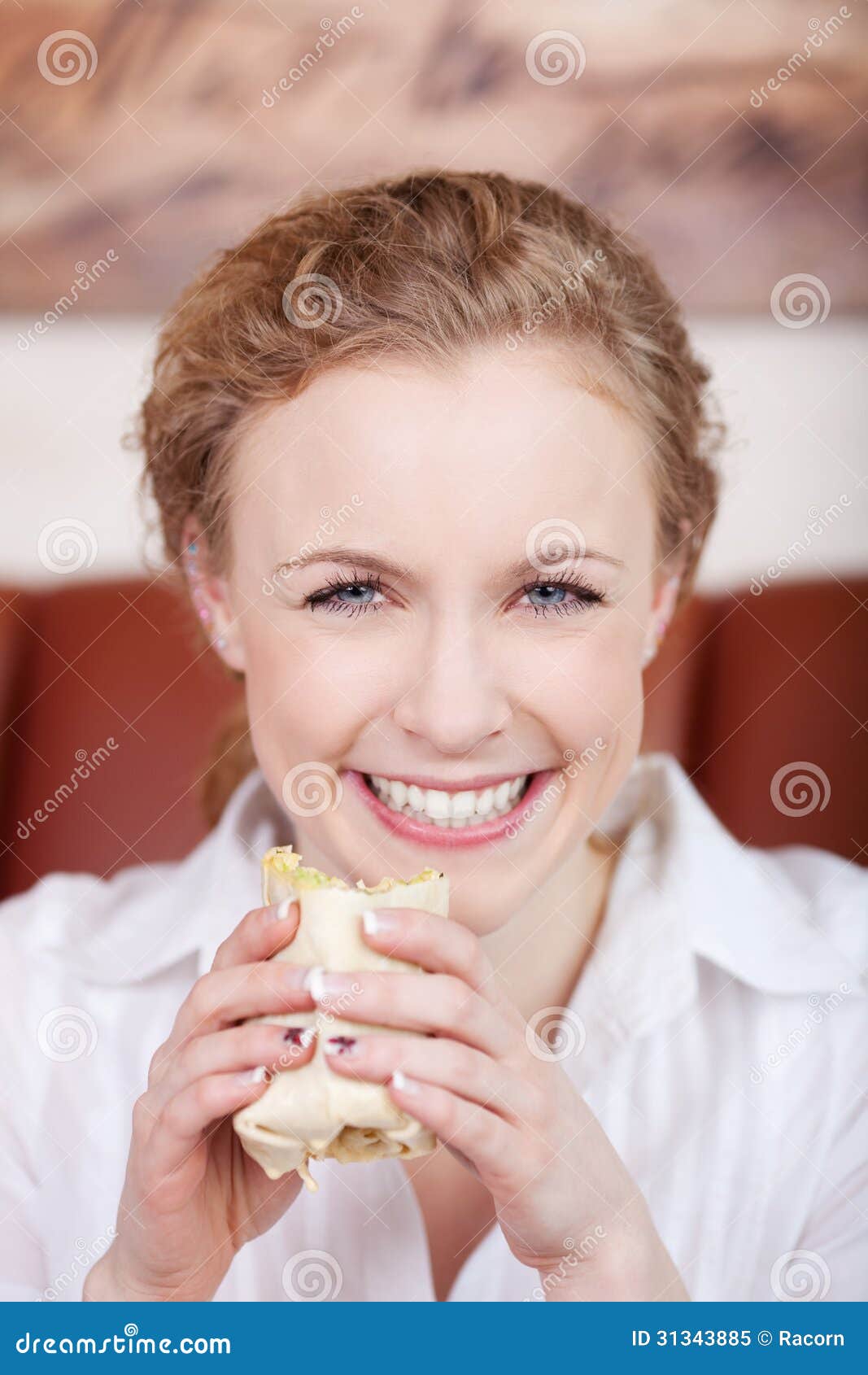 Smiling Blond Woman Eating Wrap Stock Image - Image of coffeeshop ...
