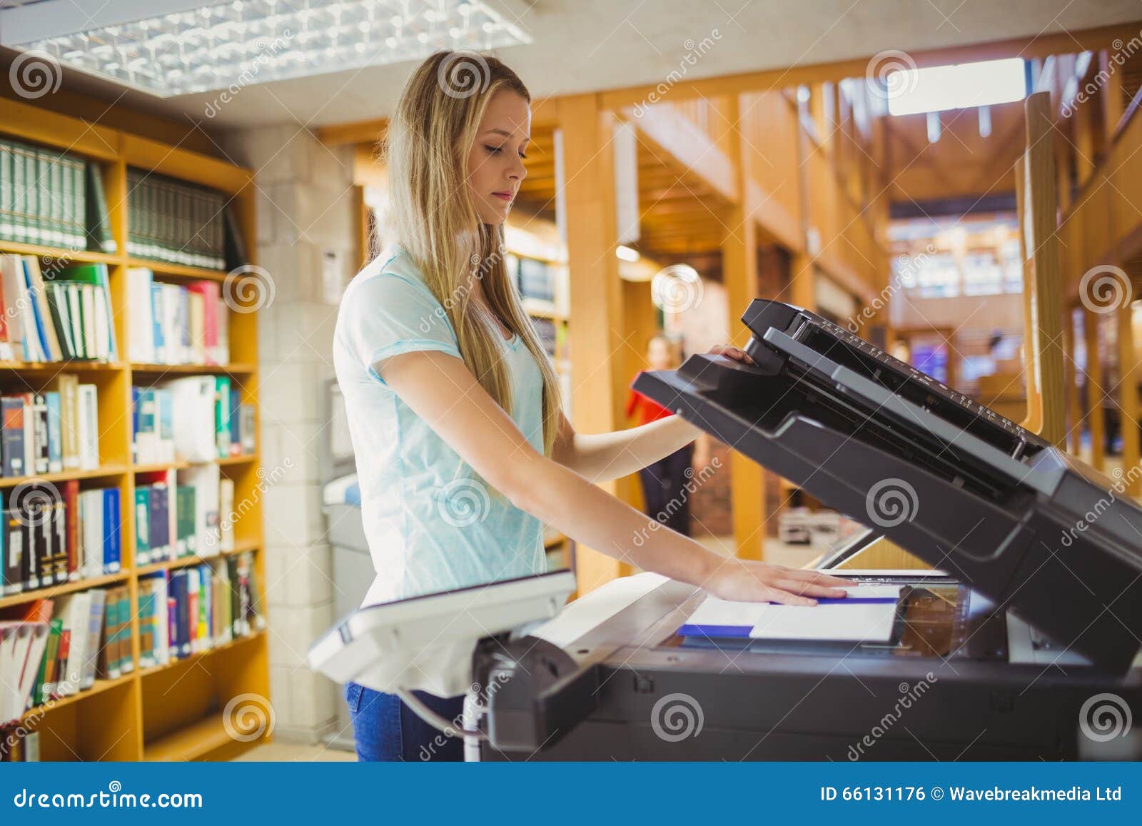 Smiling Blonde Student Making a Copy Stock Photo - Image of college ...